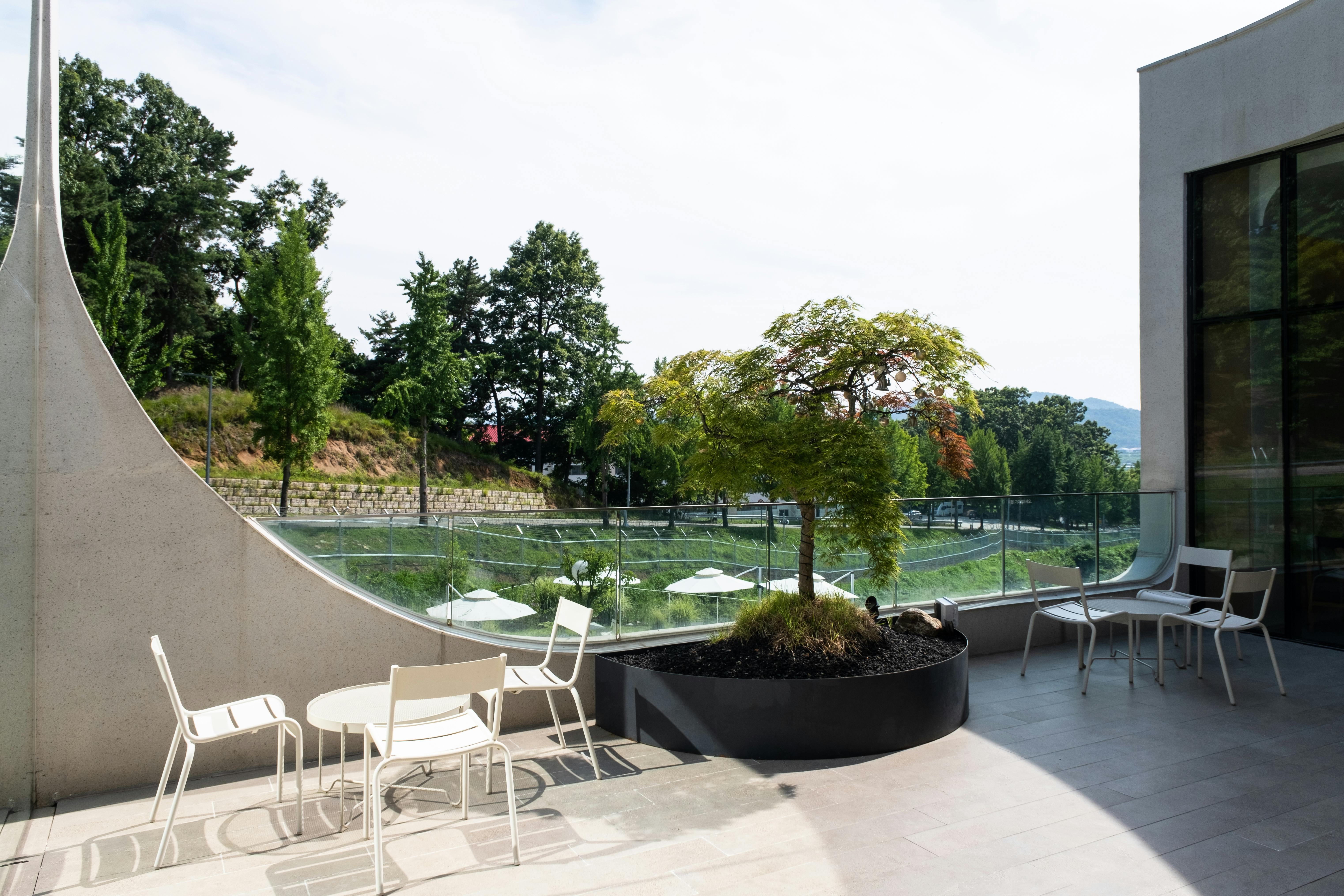 White Cafe Furniture on a Terrace with Scenic View · Free Stock Photo