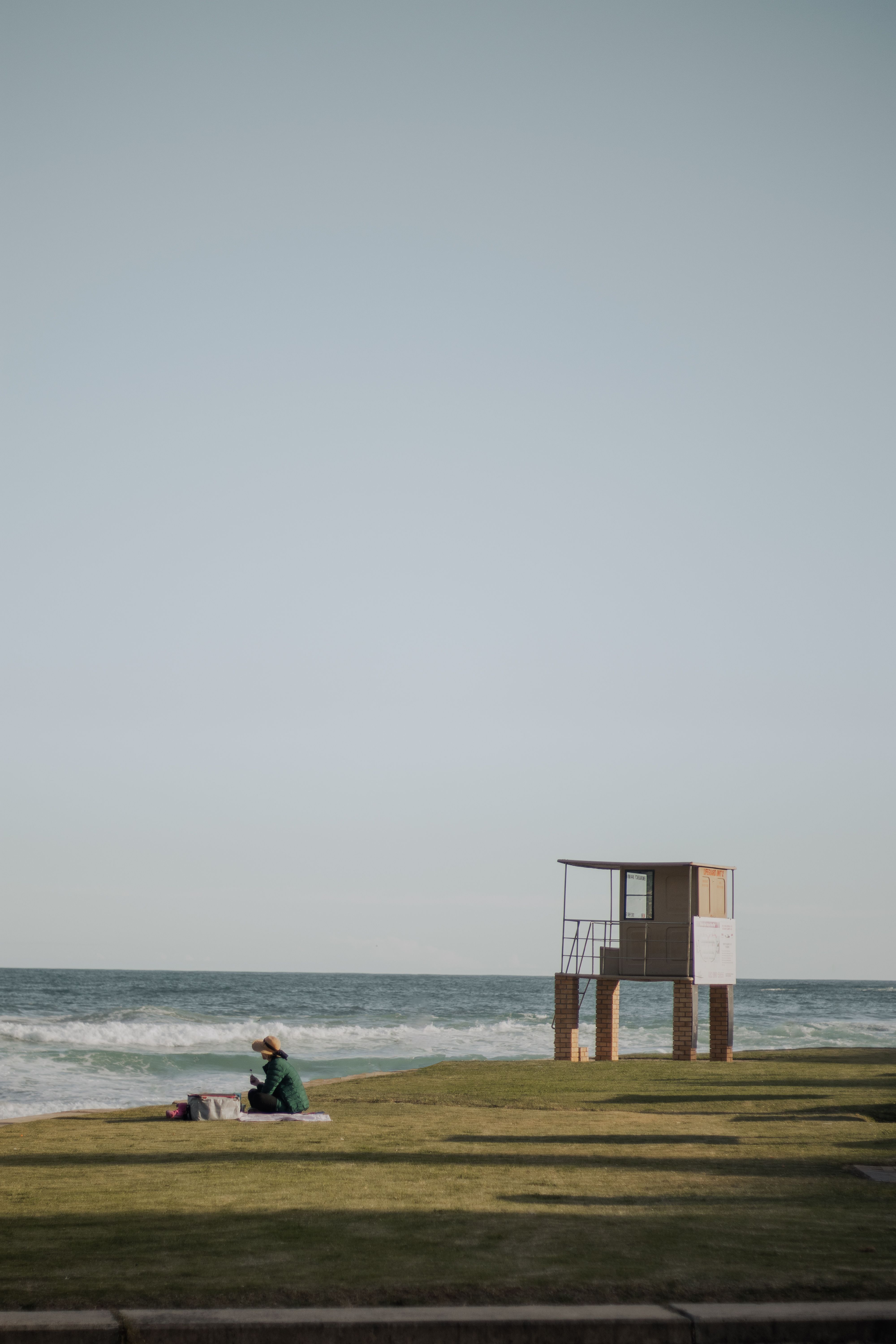 Woman Sitting on the Beach · Free Stock Photo