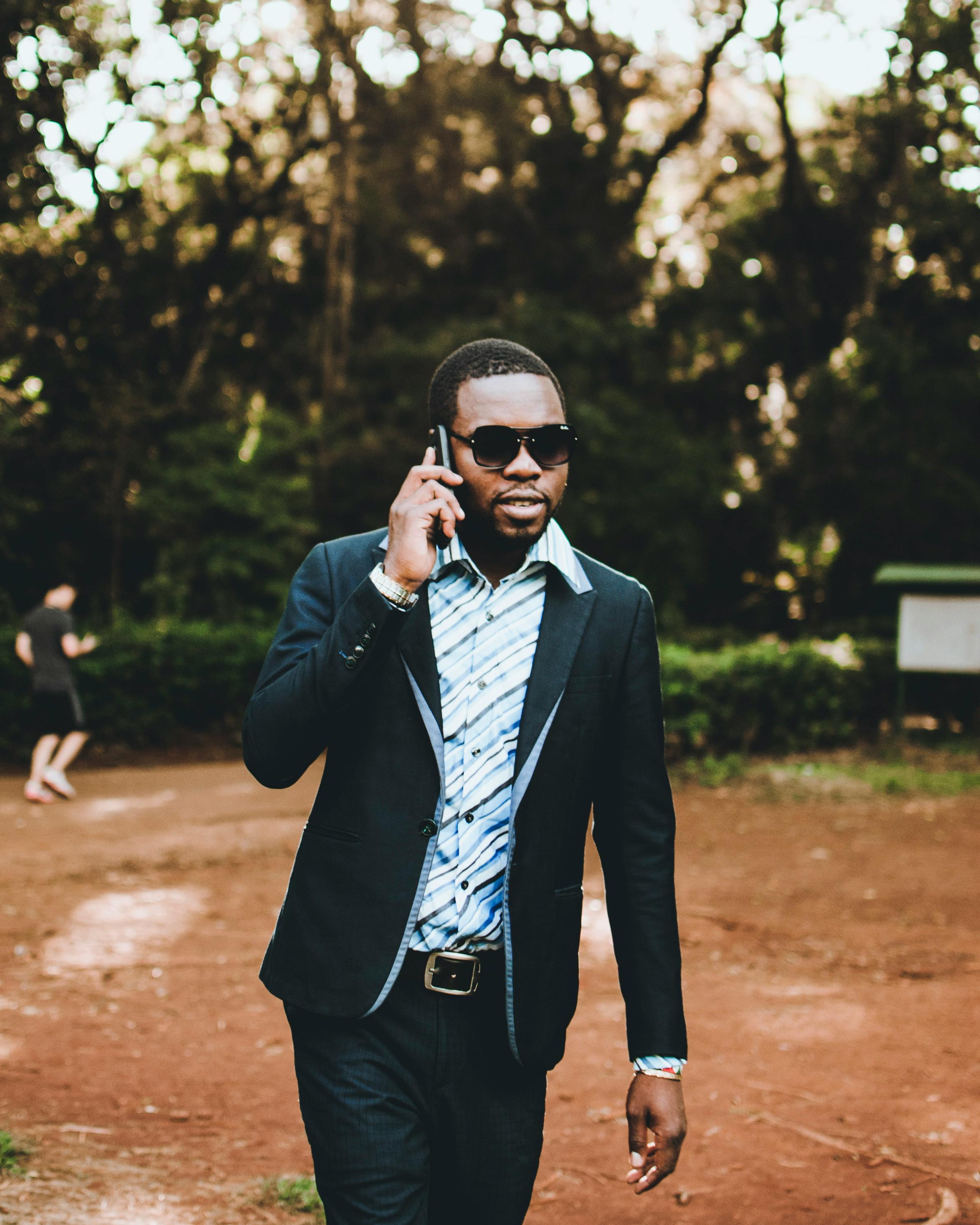 Man in Red and White Clothes Standing Near Street · Free Stock Photo