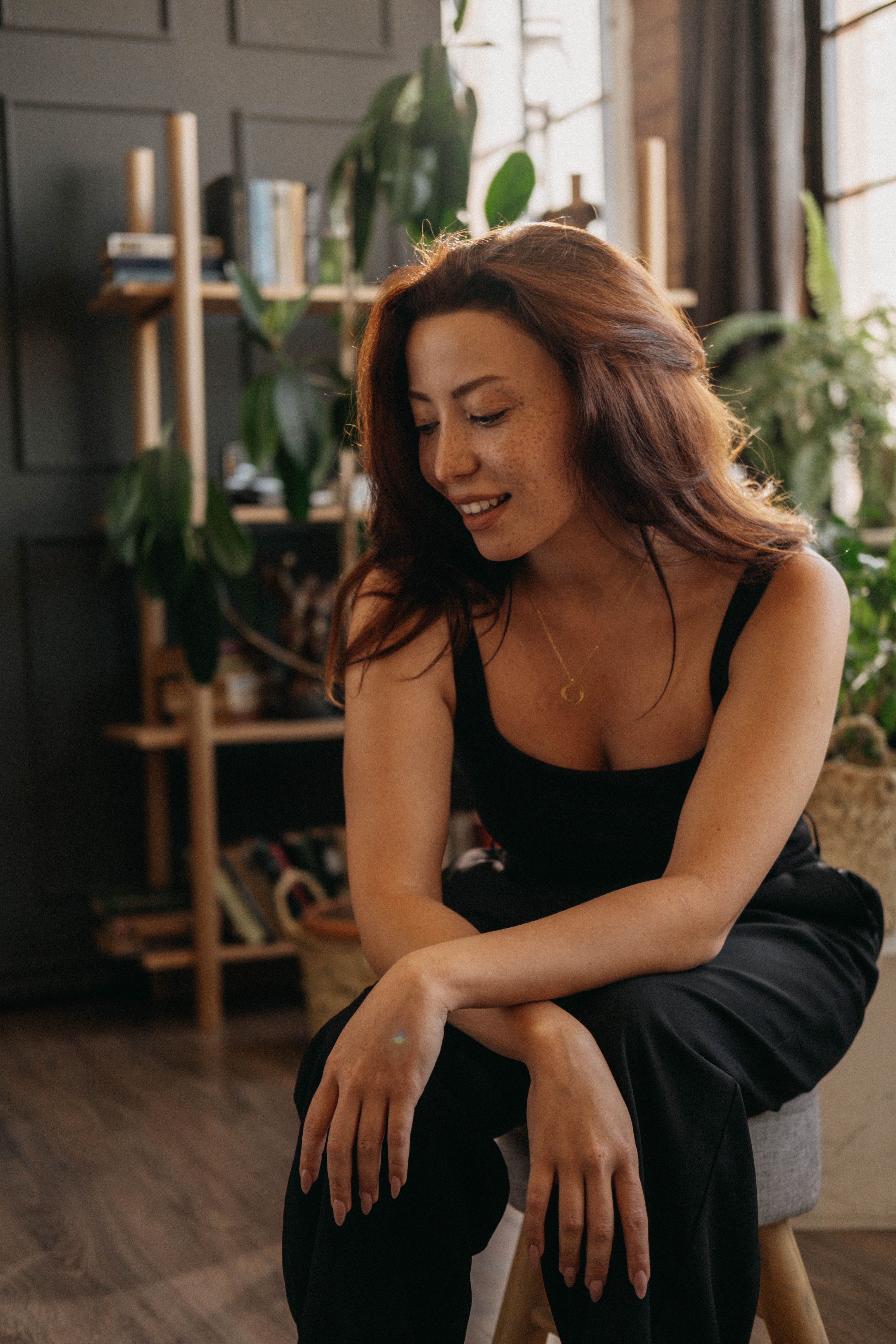 Smiling Woman Sitting · Free Stock Photo