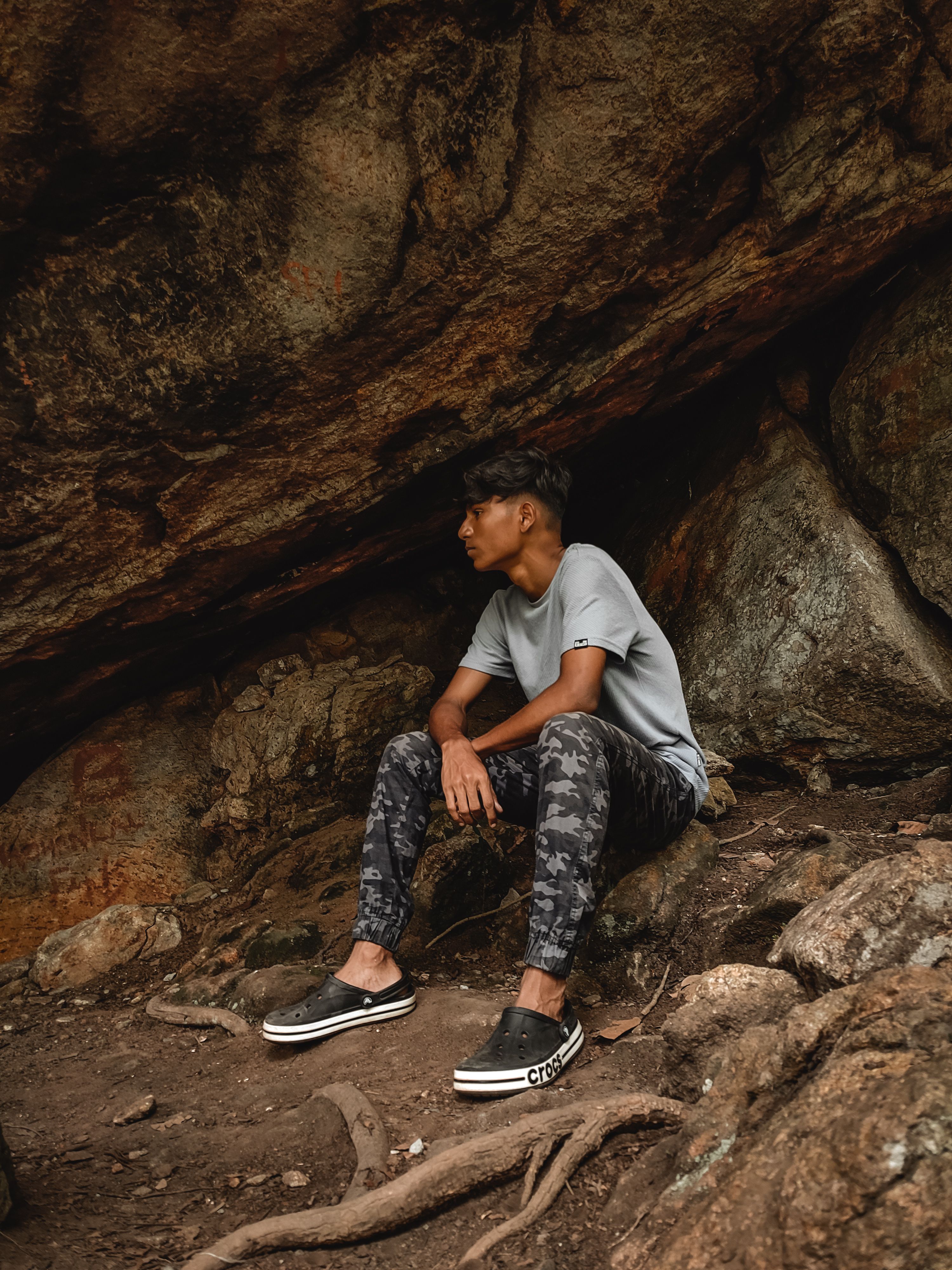 Photo of Man Sitting on Cliff · Free Stock Photo