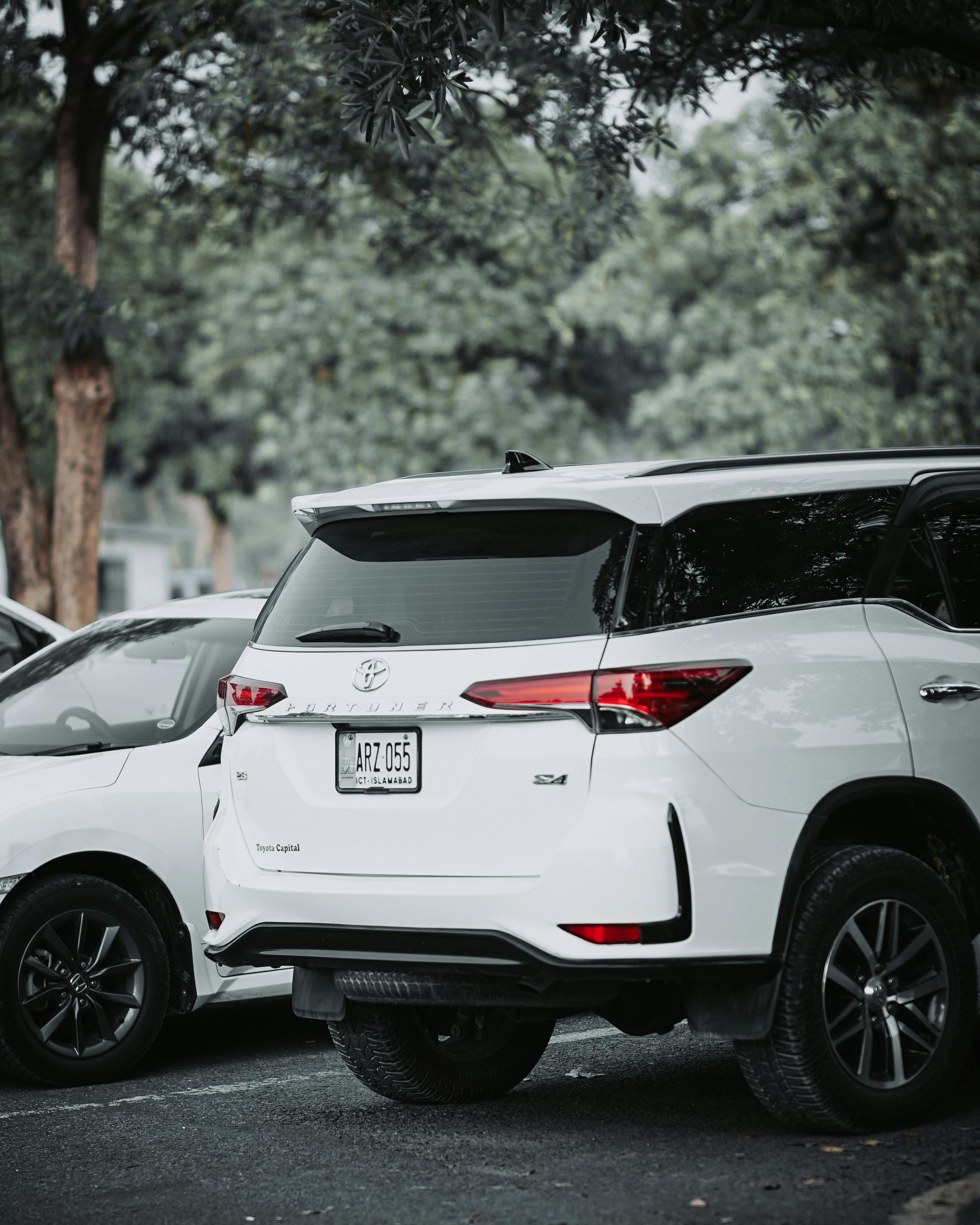 Back of a White Toyota Fortuner Standing in a Parking Lot · Free Stock ...
