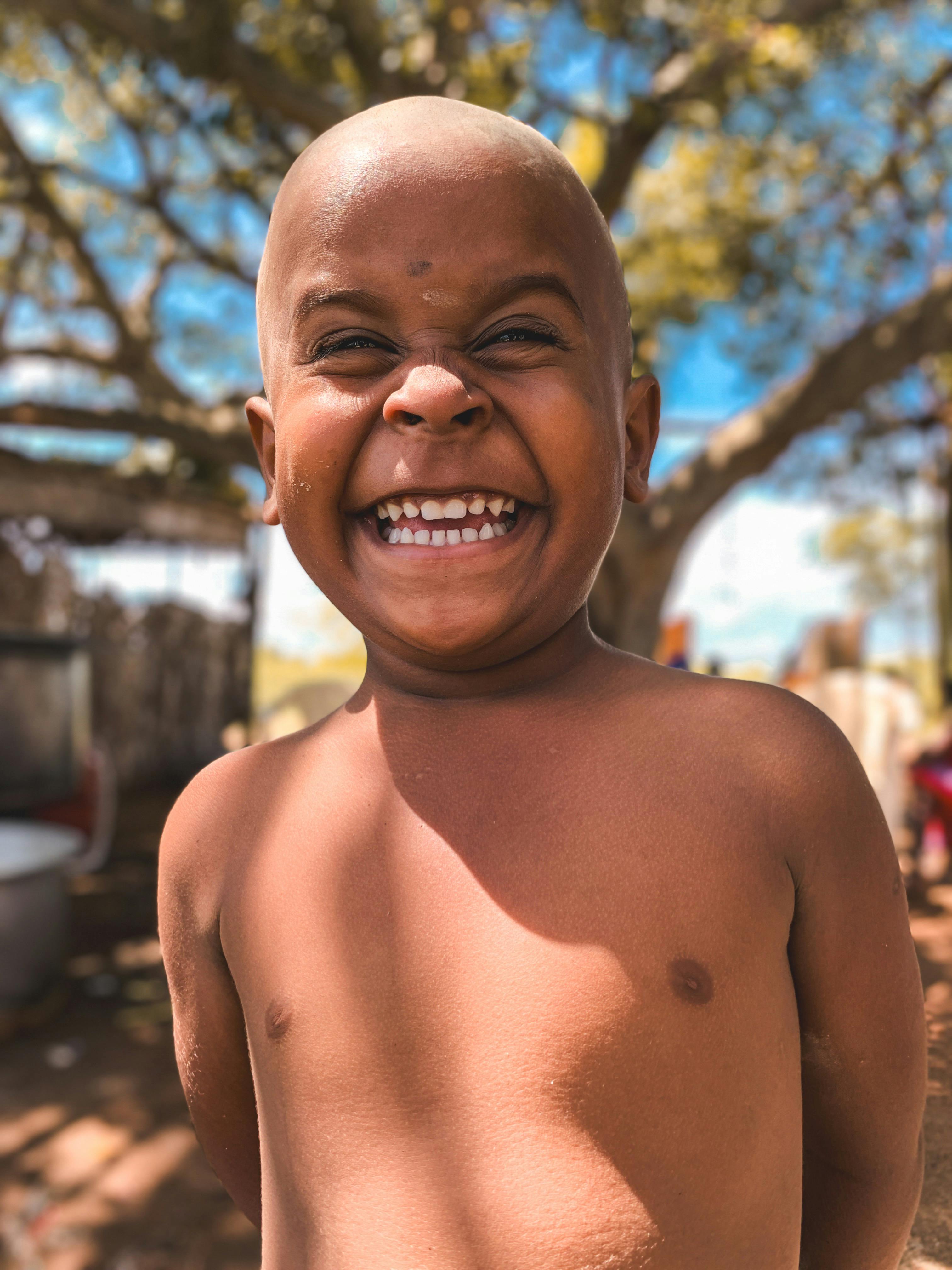Grinning Bald Boy · Free Stock Photo