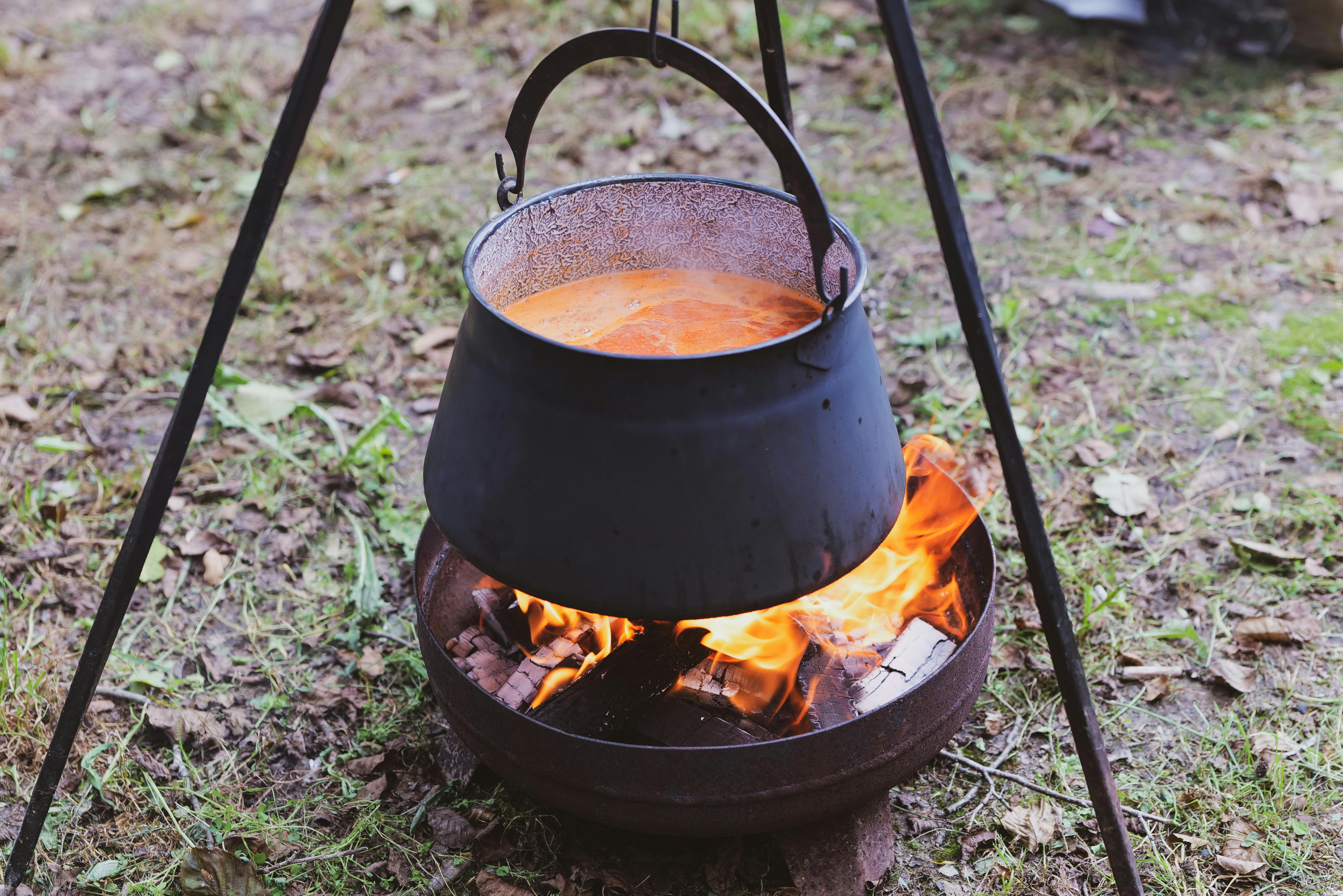A pot of soup on a campfire · Free Stock Photo