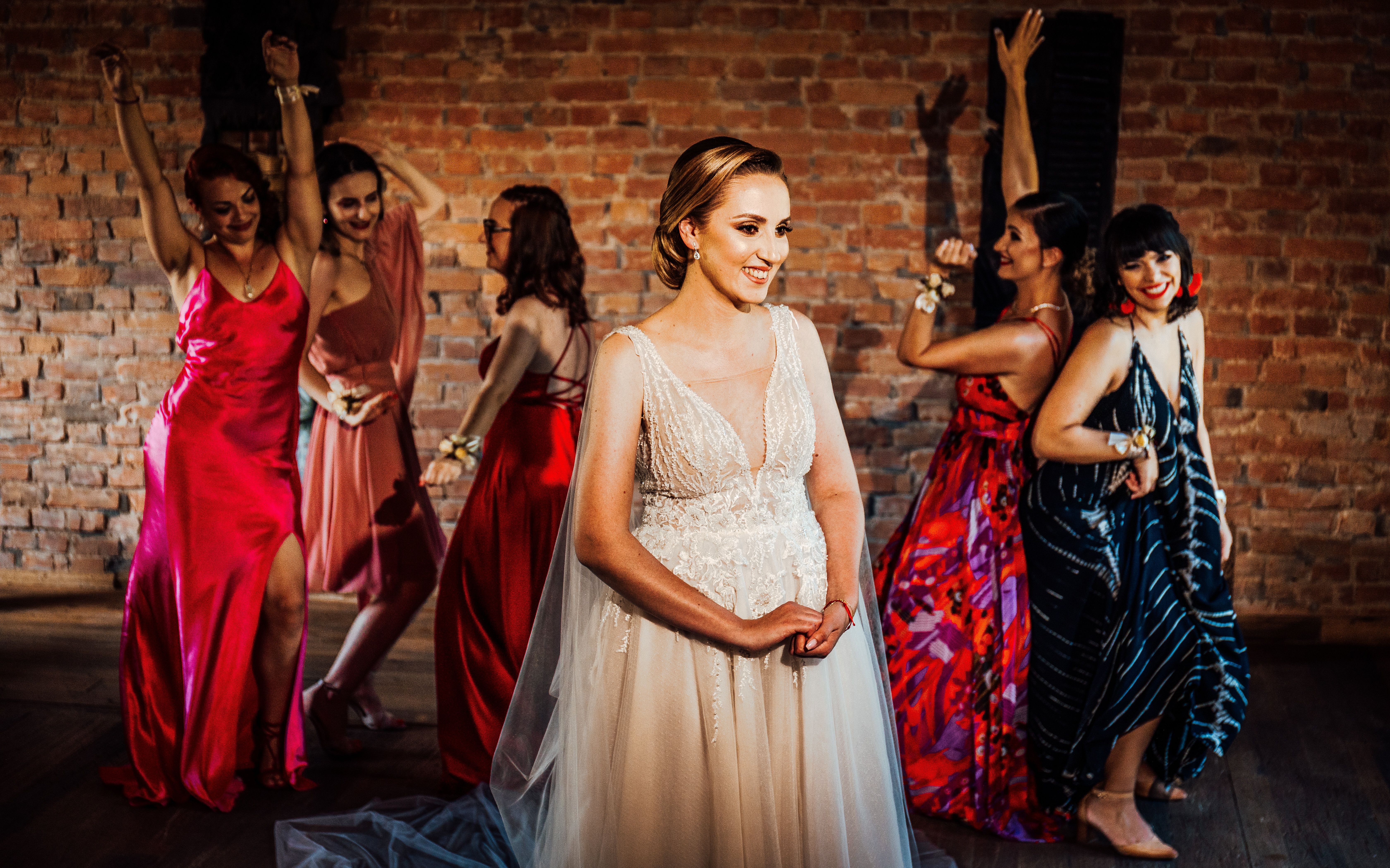 Smiling Bride and Bridesmaids Dancing behind · Free Stock Photo