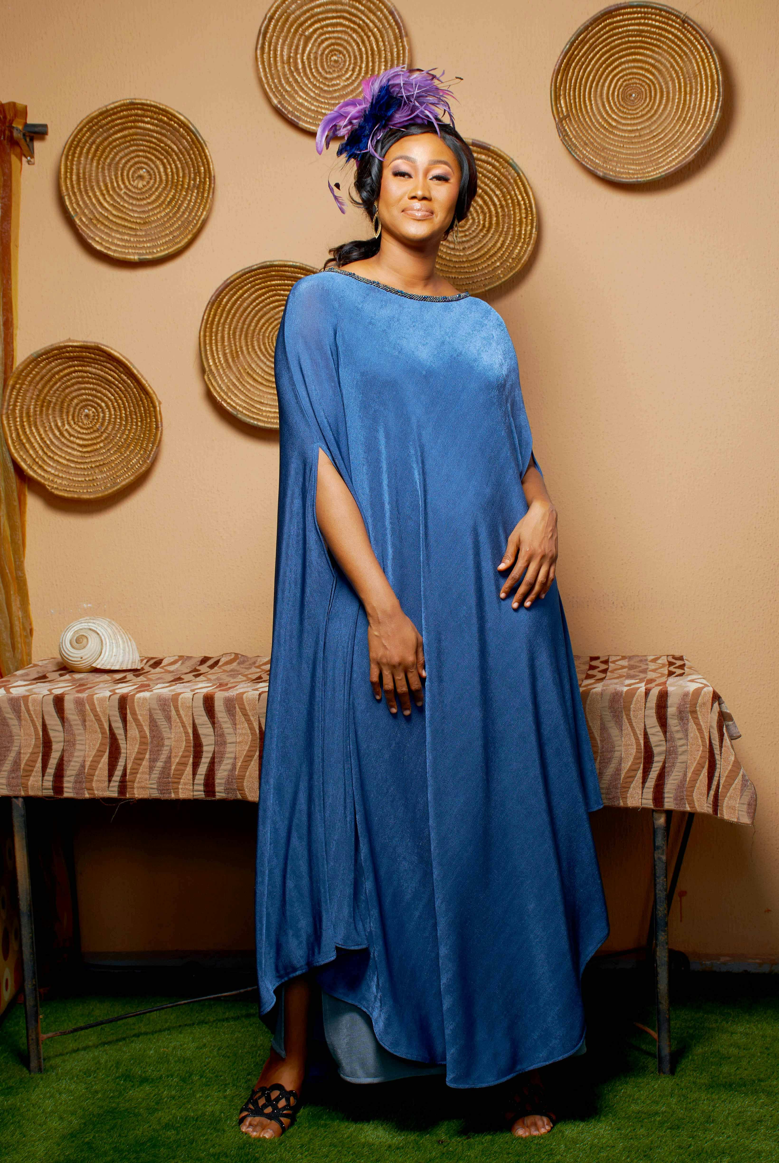 Young Woman Wearing a Patterned Gown and a Headdress · Free Stock Photo