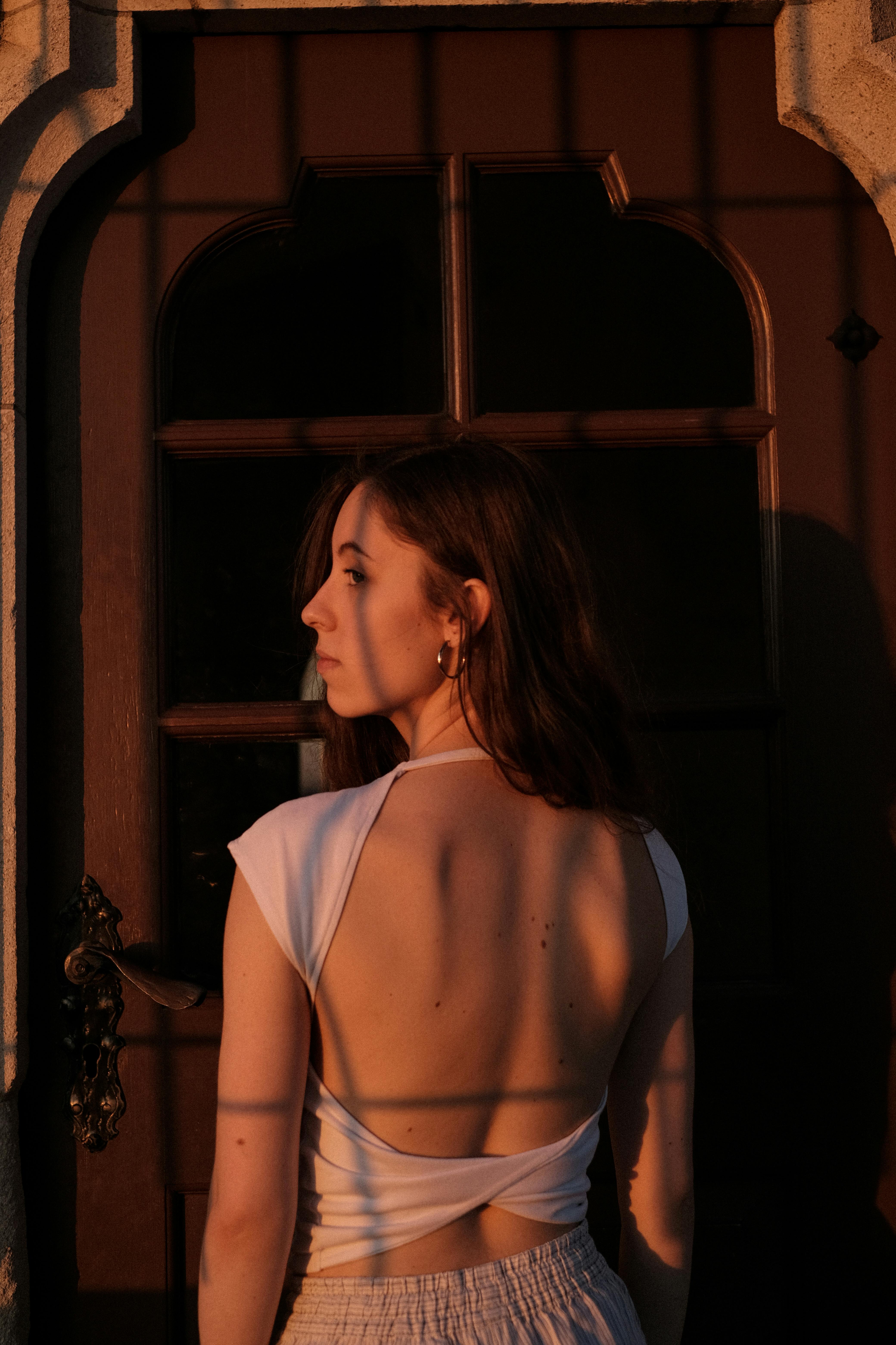 Sunlit Back of Woman · Free Stock Photo
