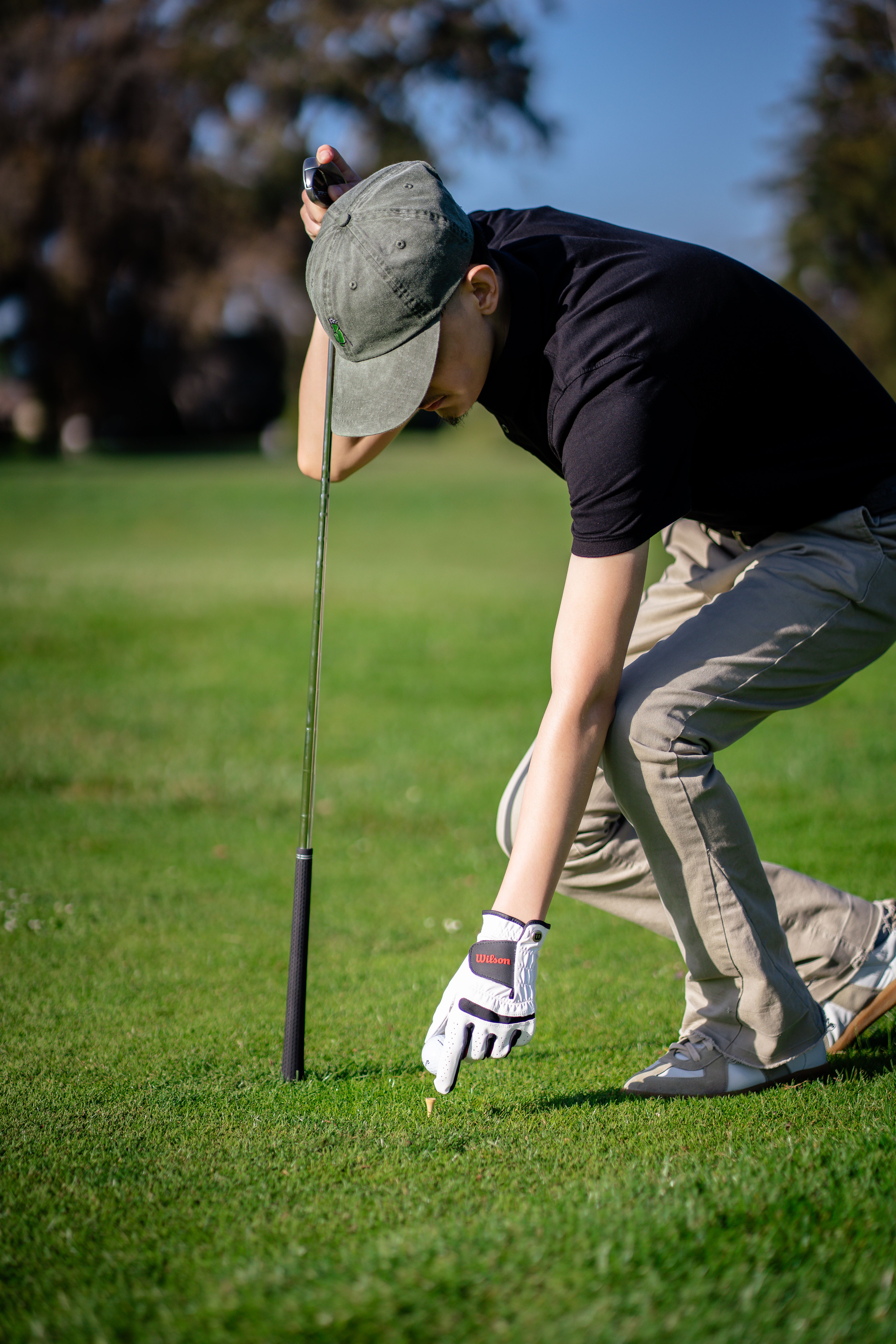Man Putting Ball on Glow Stick at Golf Field · Free Stock Photo