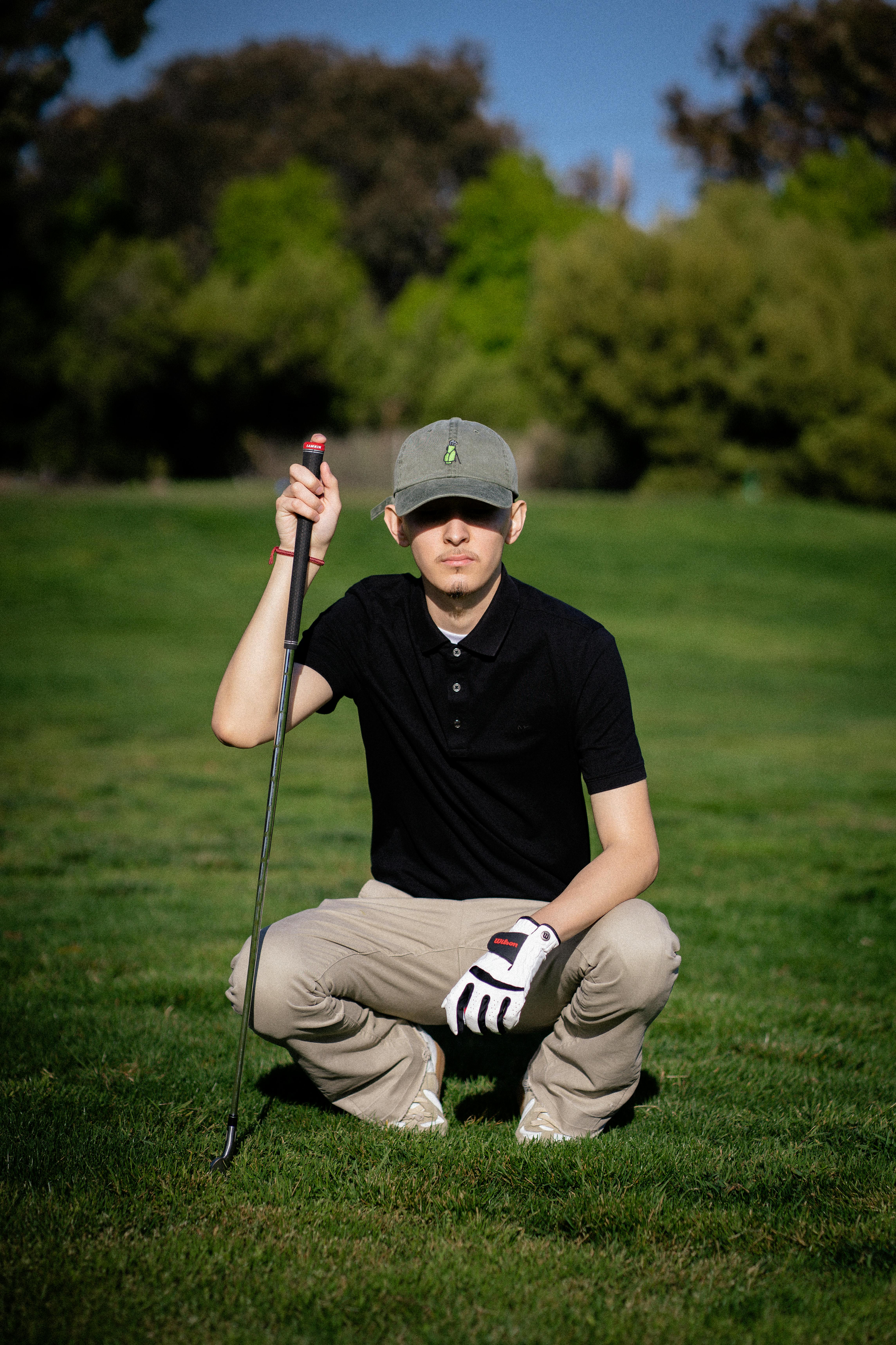 Man Crouching with Gold Stick · Free Stock Photo