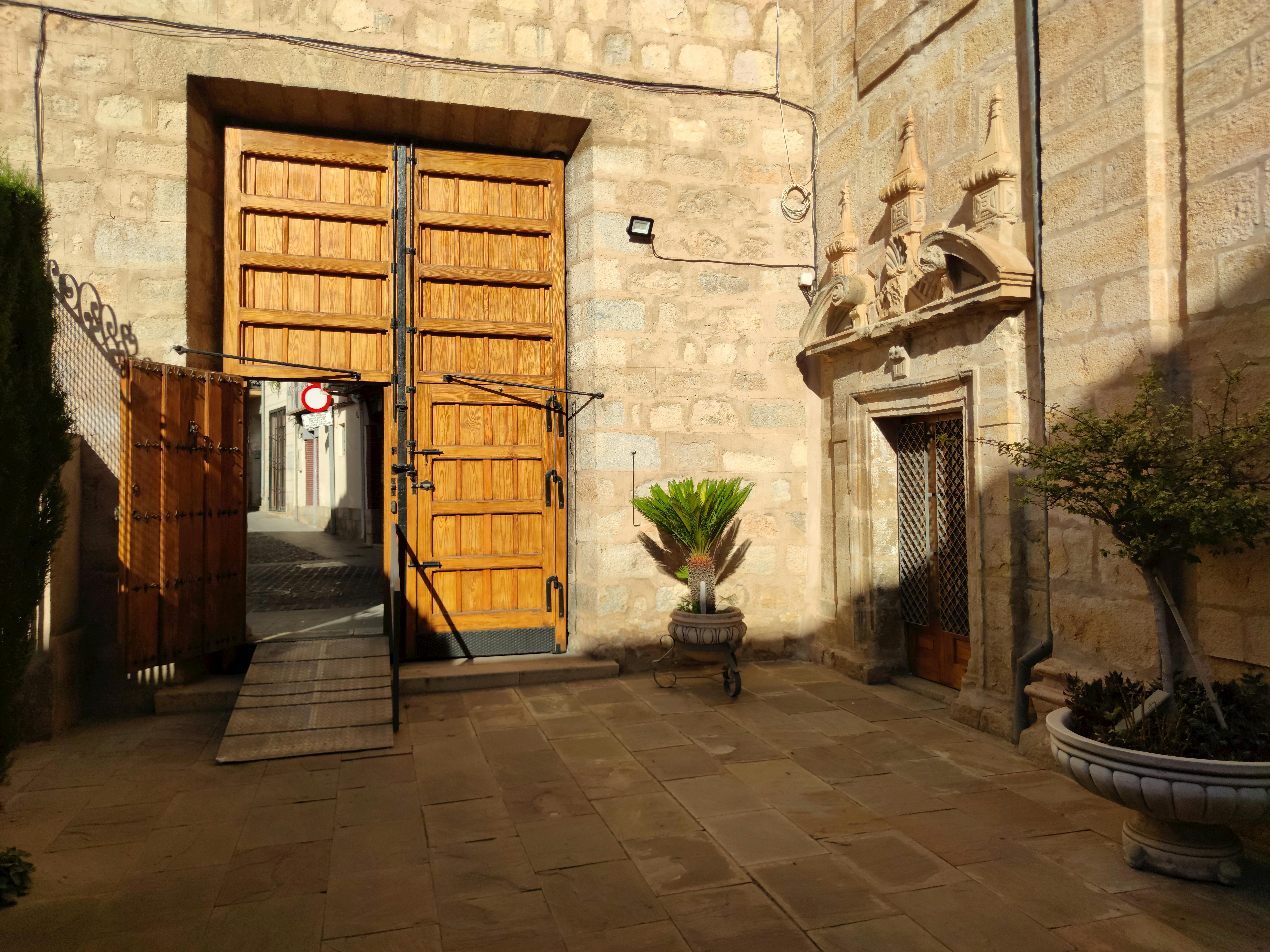 Sunlit Stone Walls and Door in Building · Free Stock Photo