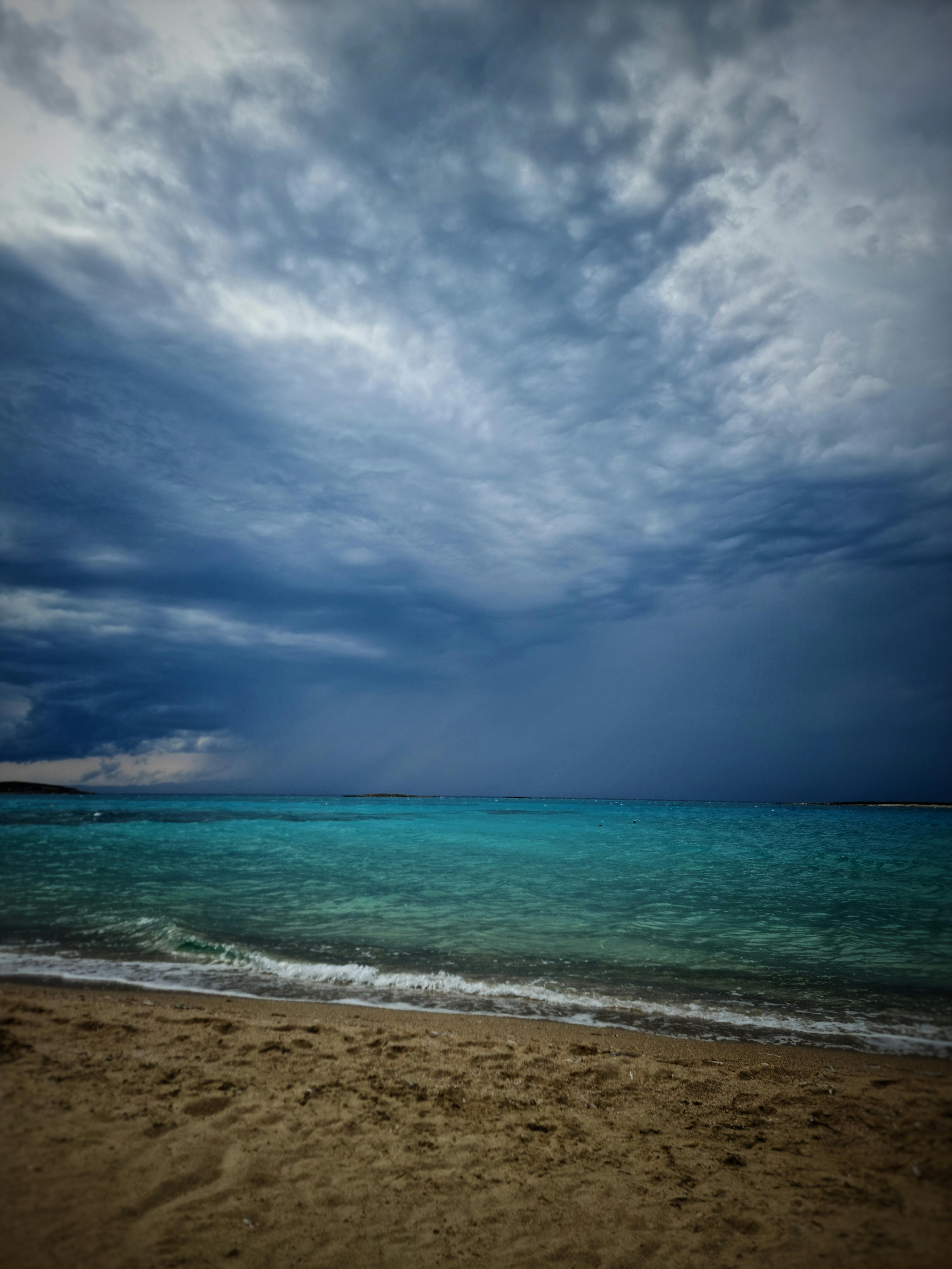 Rain Clouds over Sea Shore · Free Stock Photo