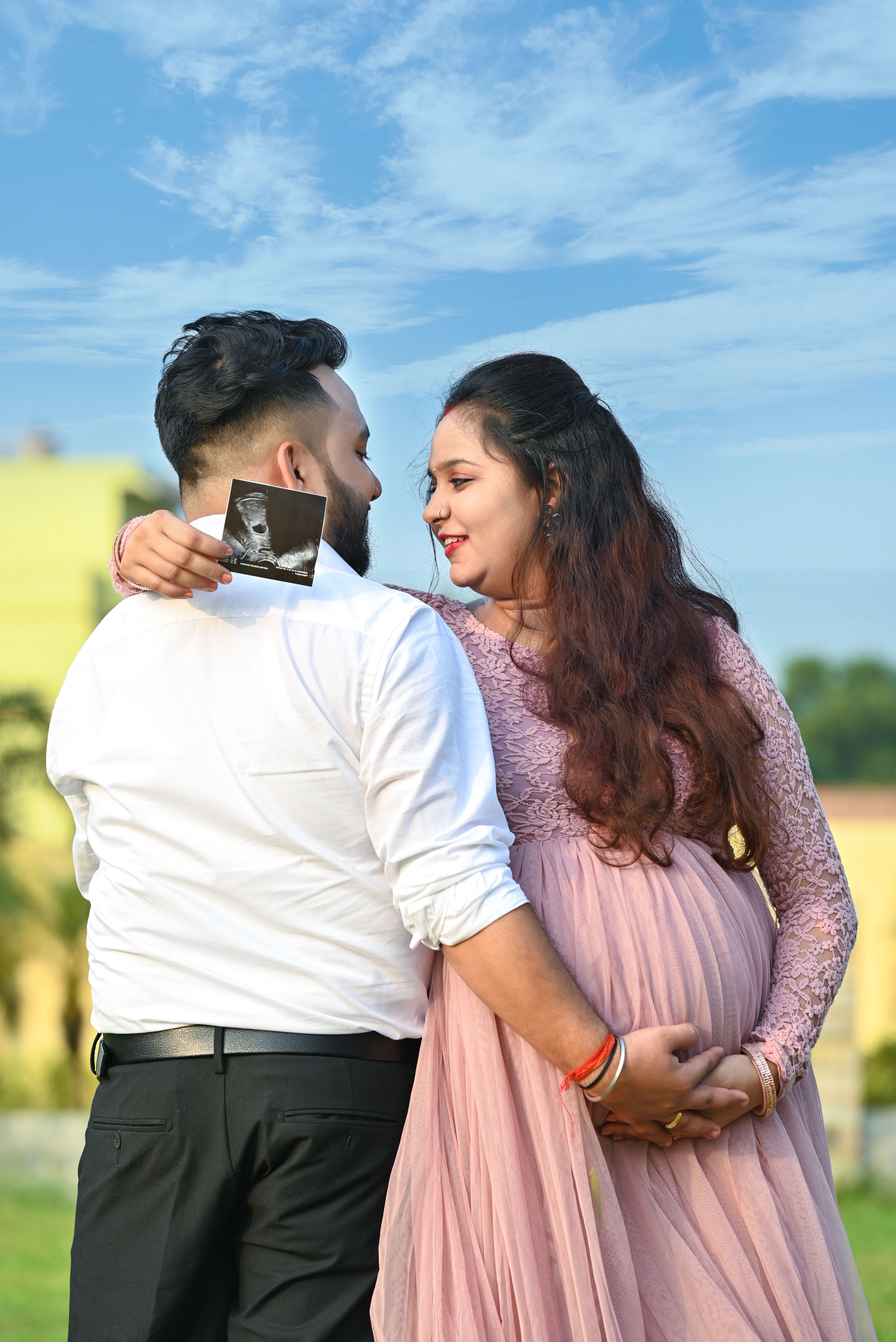 Couple Hugging by Building · Free Stock Photo