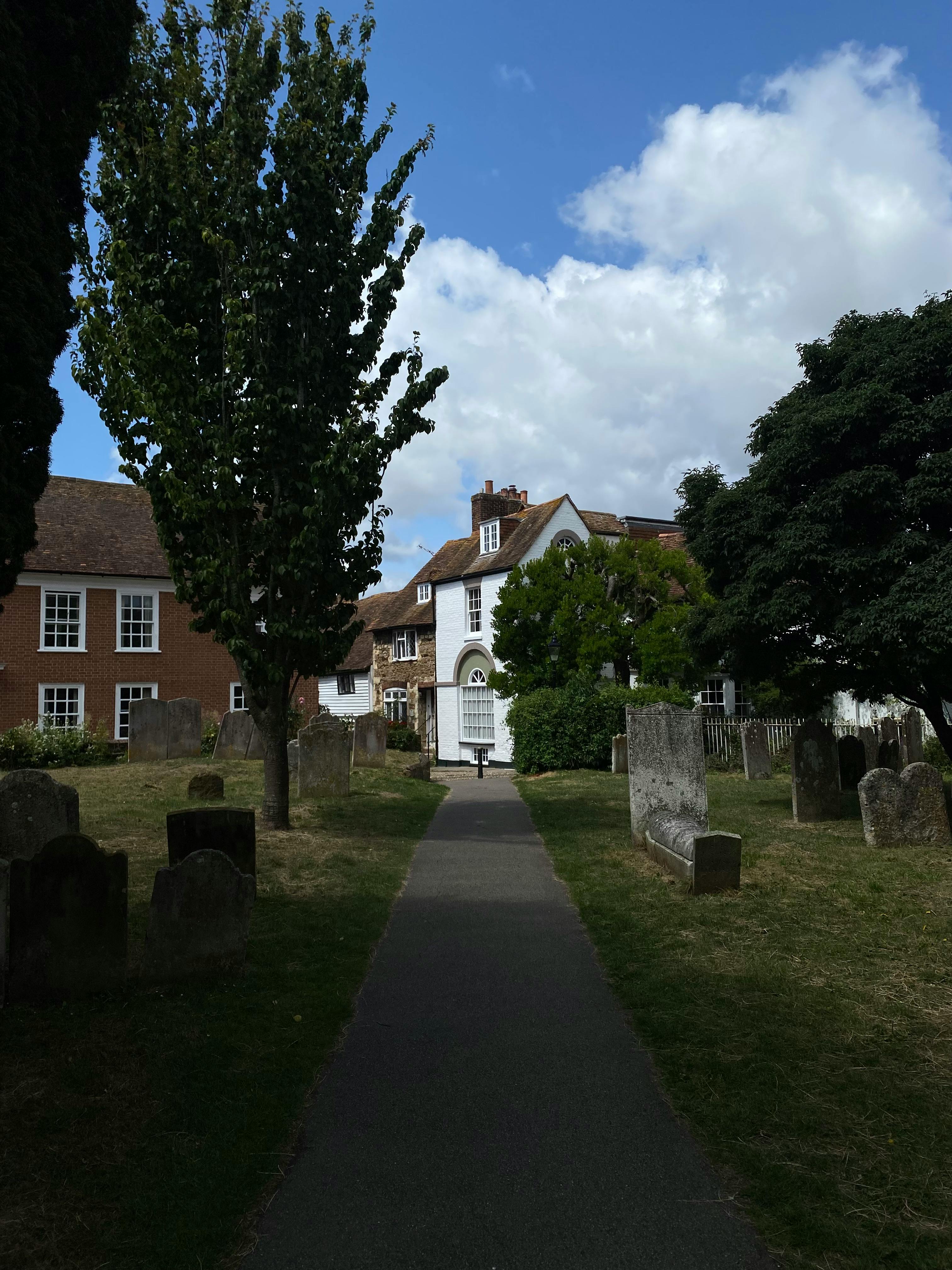 Footpath in Cemetery Leading to Town · Free Stock Photo