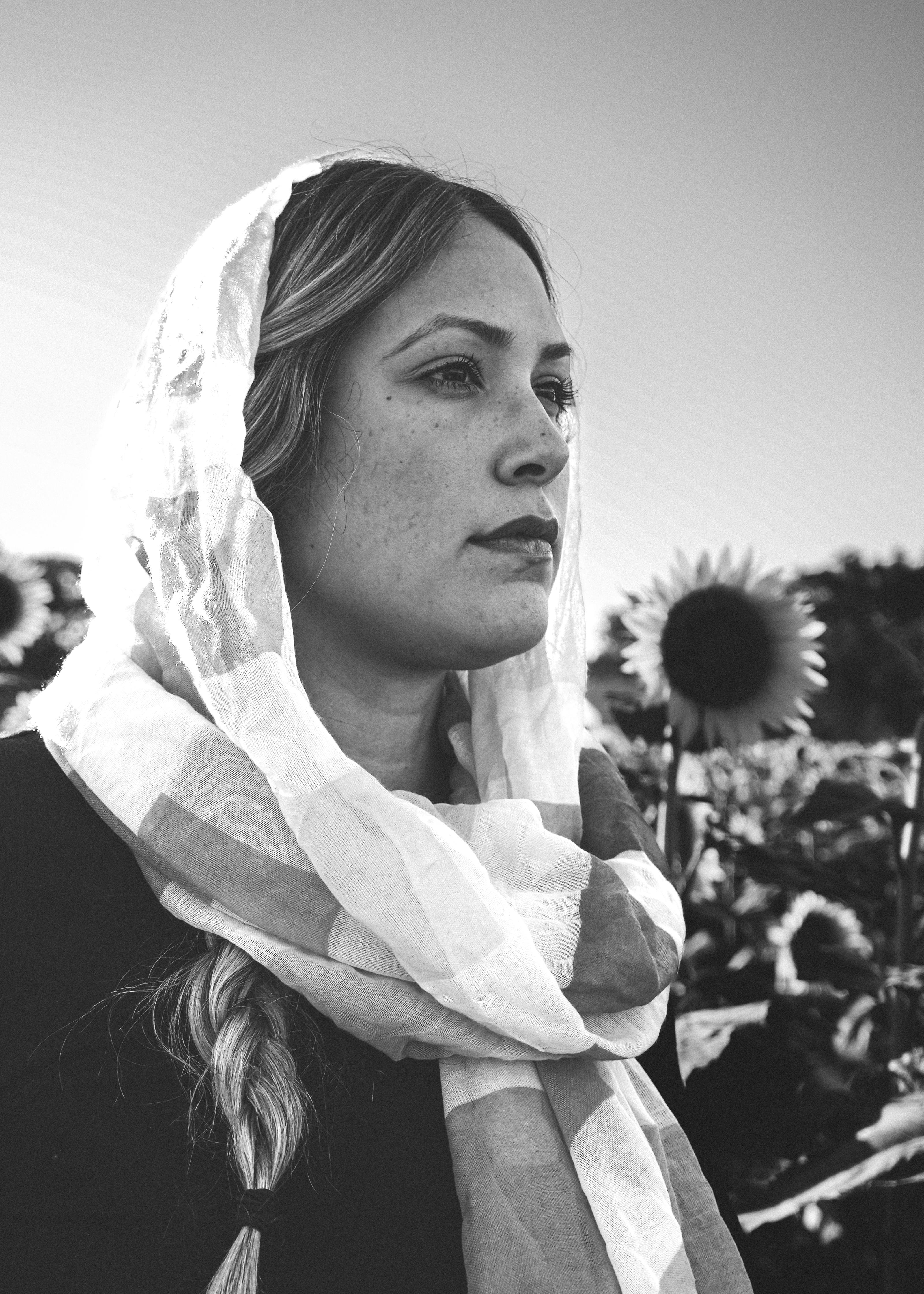 Woman in Handkerchief on Field of Sunflowers · Free Stock Photo
