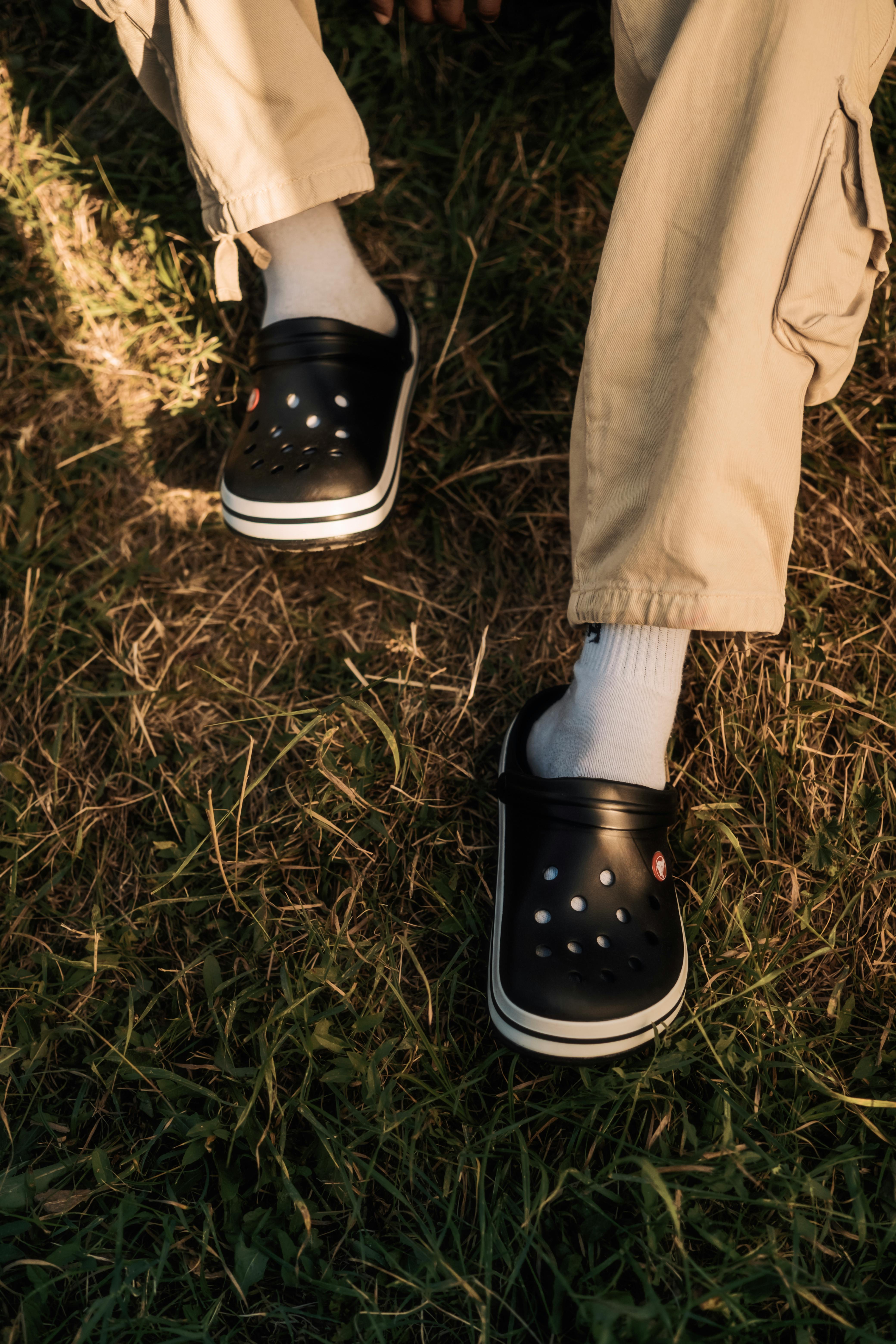 Legs in Socks and Crocks · Free Stock Photo