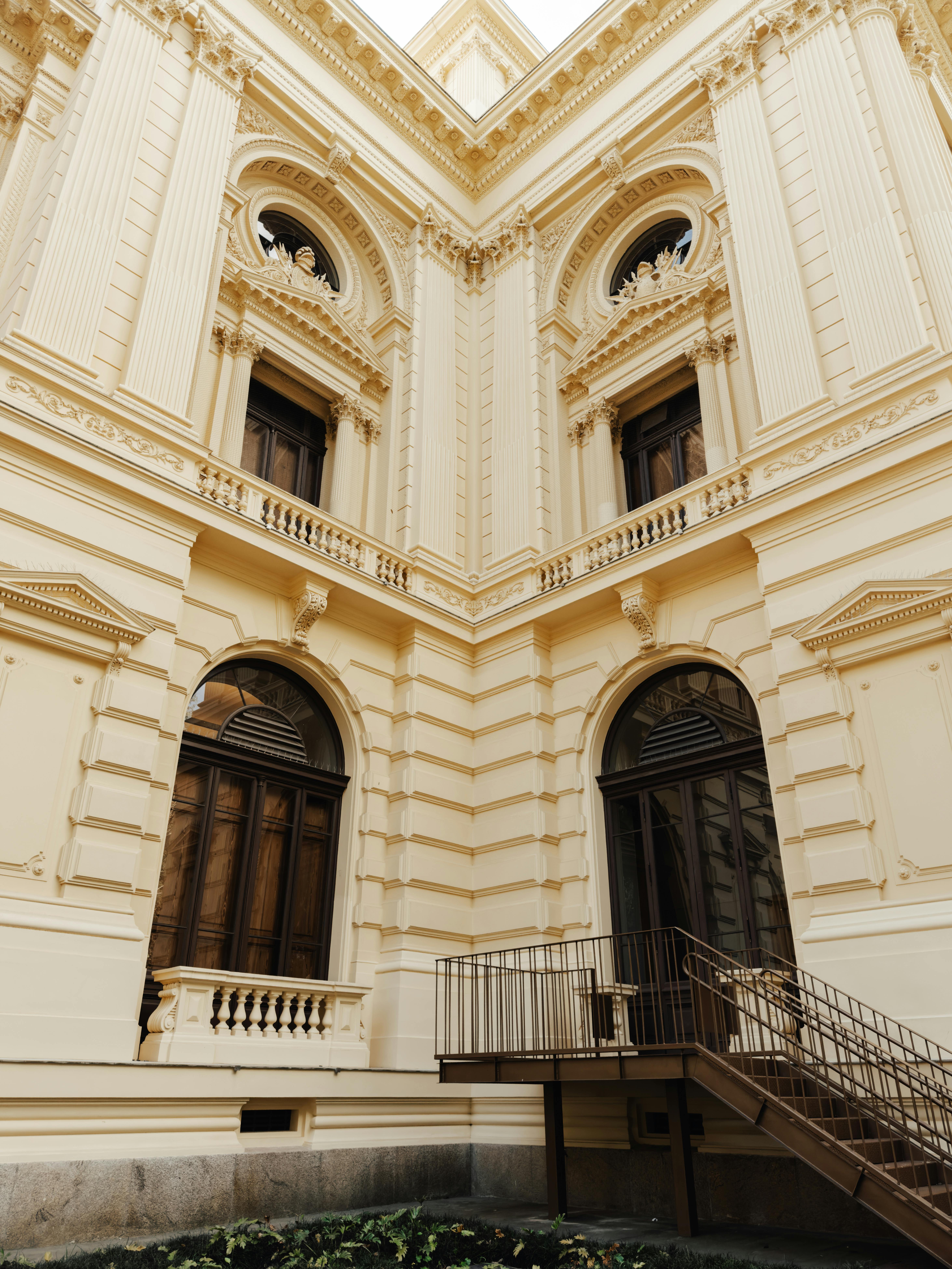 Inner Yard of a Neoclassical Building with Balconies Decorated with ...