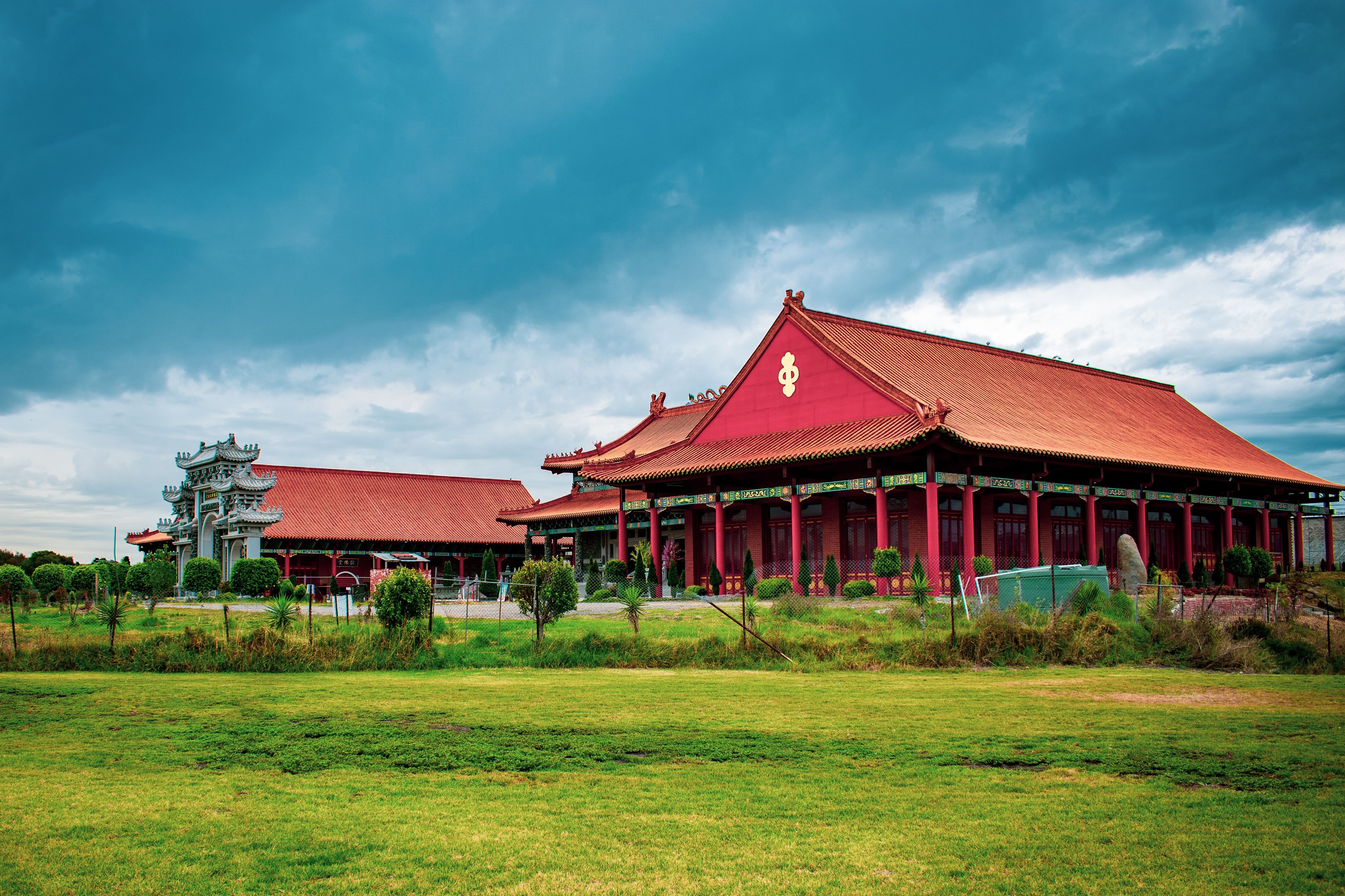 Buddhist Temple with Red Columns and Red Tiled Rooftops · Free Stock Photo