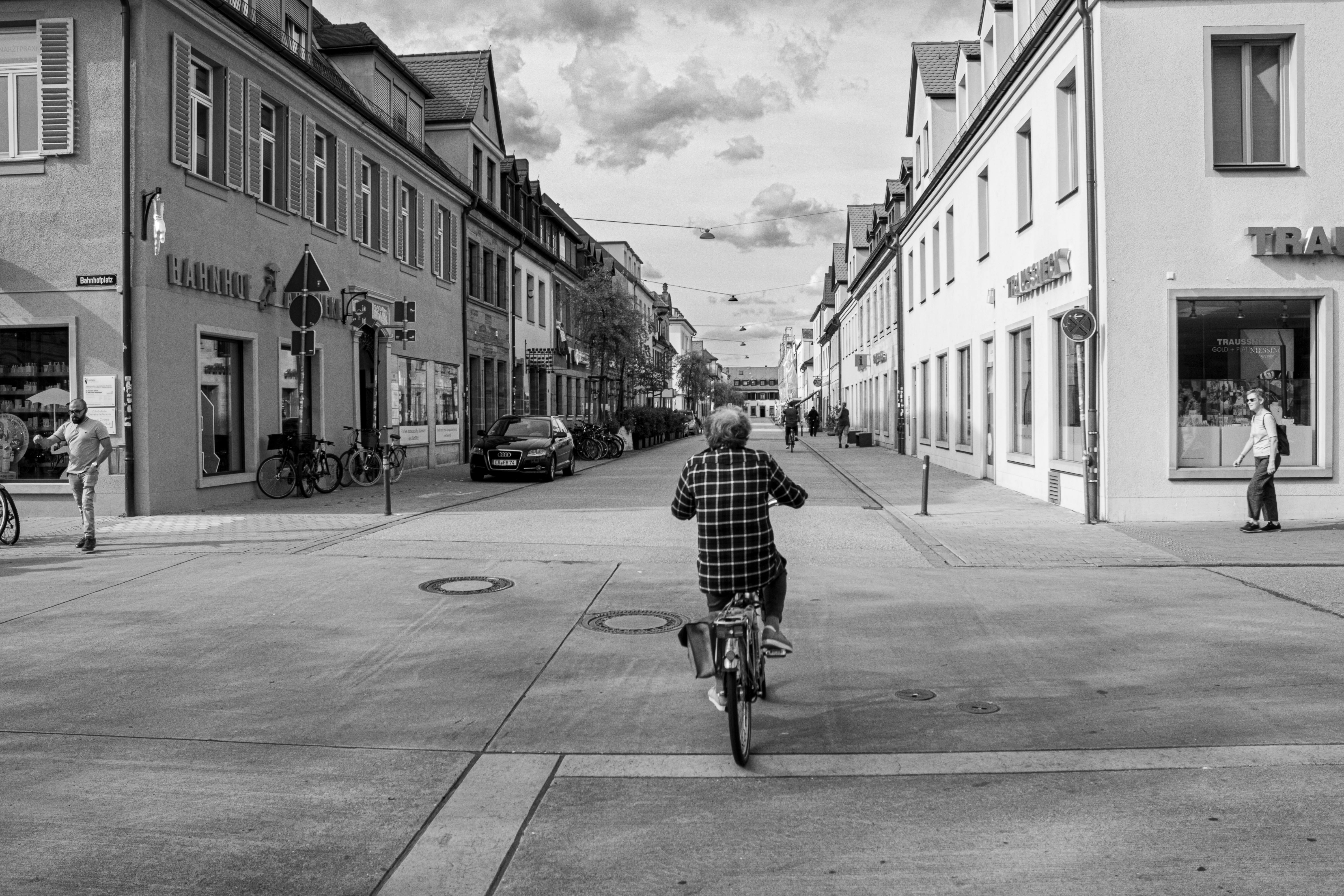 Woman Riding Bike Crossing Street Intersection · Free Stock Photo