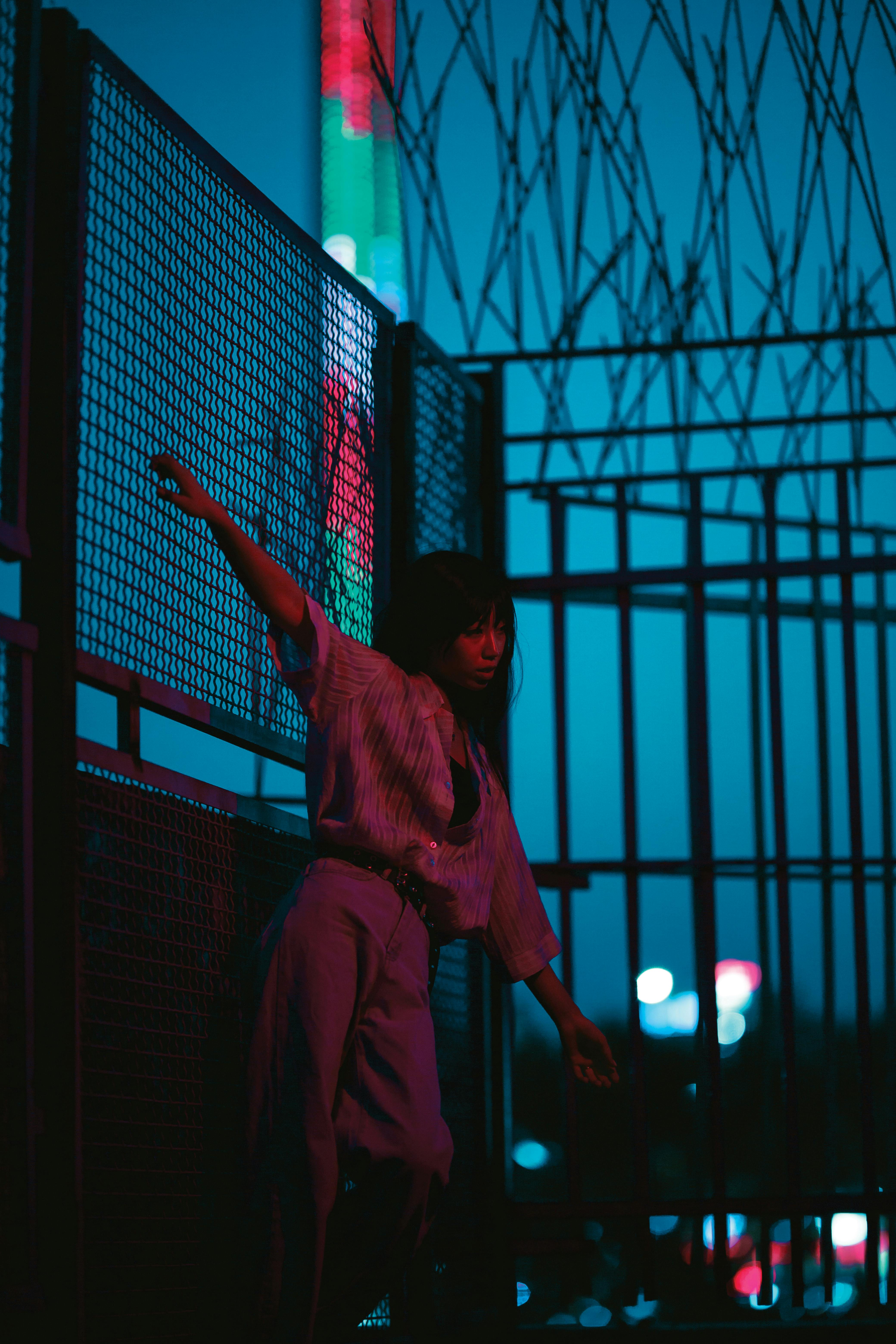 Woman Dancing on Rooftop at Night · Free Stock Photo