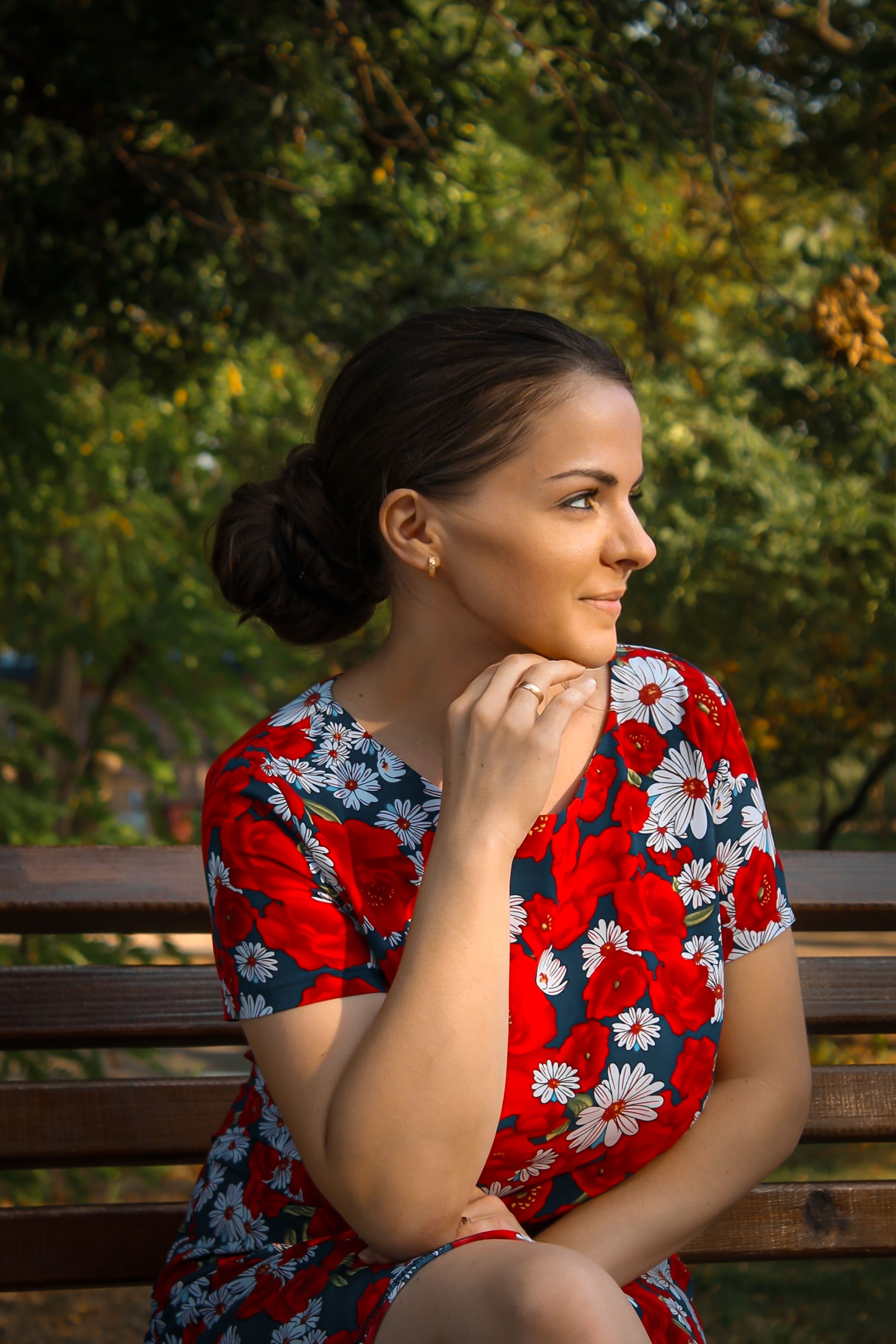 Portrait of Woman in Sundress Sitting on Bench · Free Stock Photo