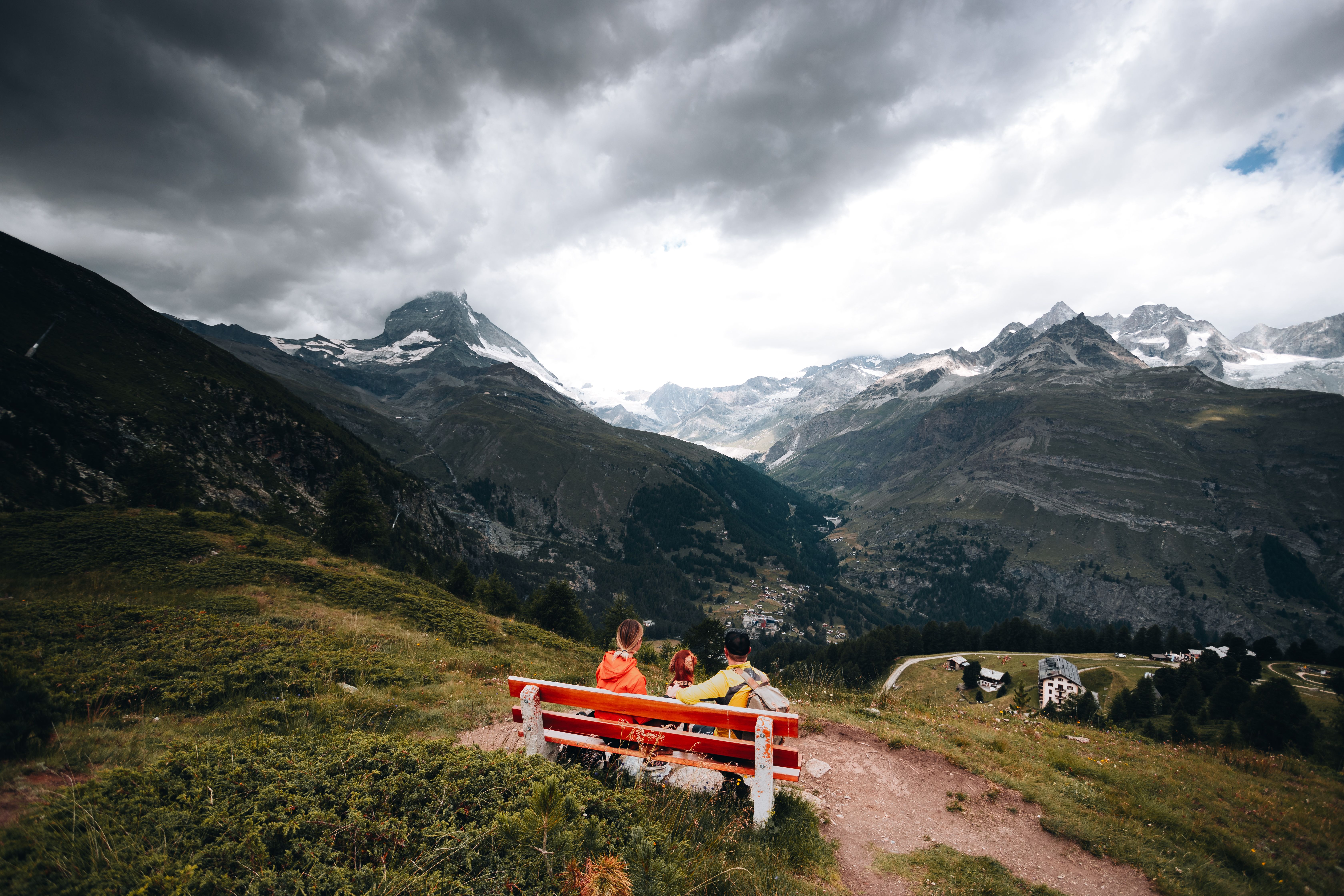 Family Sitting Bench on Mountain Trail Overlooking Valley · Free Stock ...