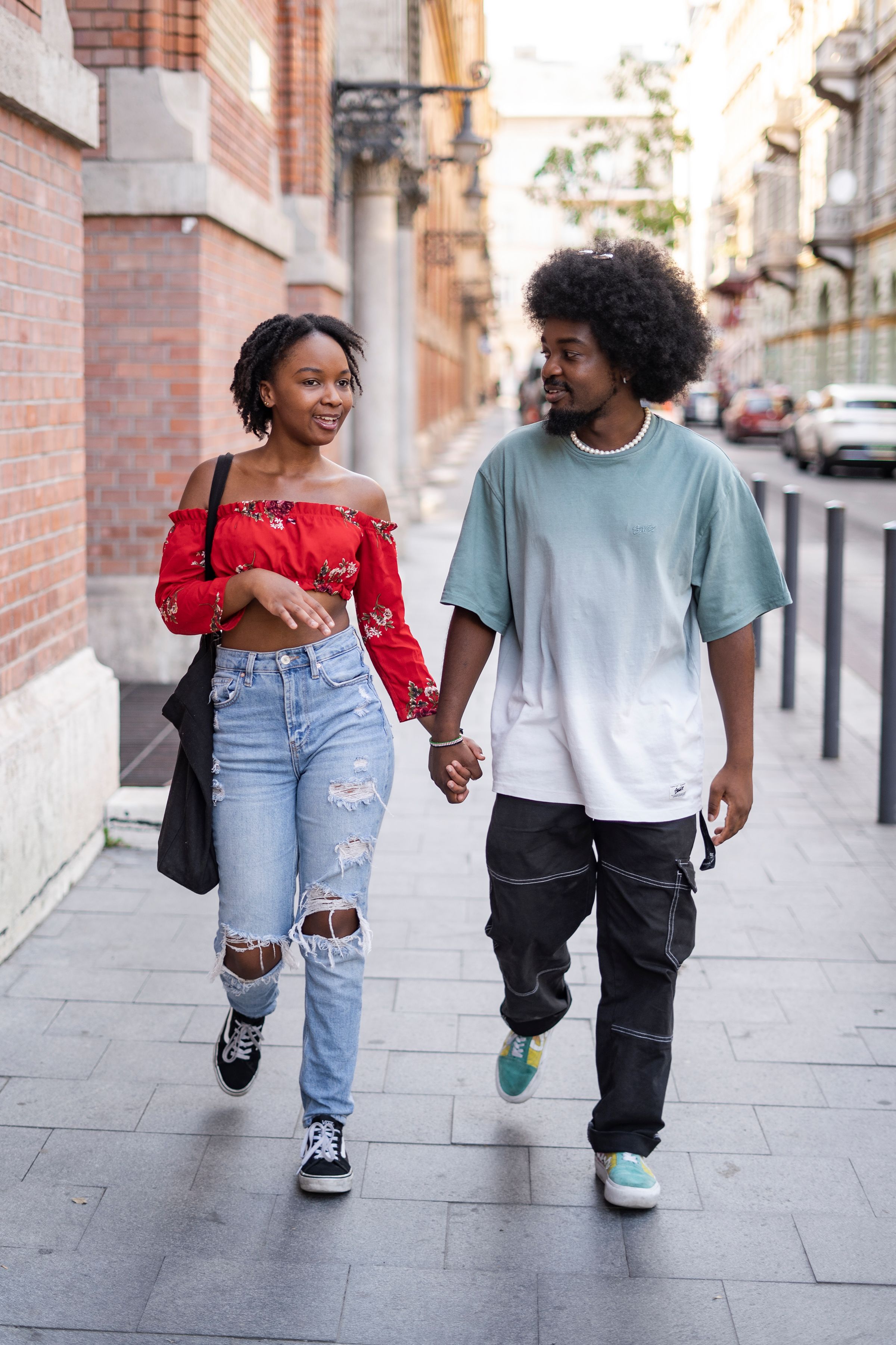 Holding Hands Couple Walk in Meadow · Free Stock Photo