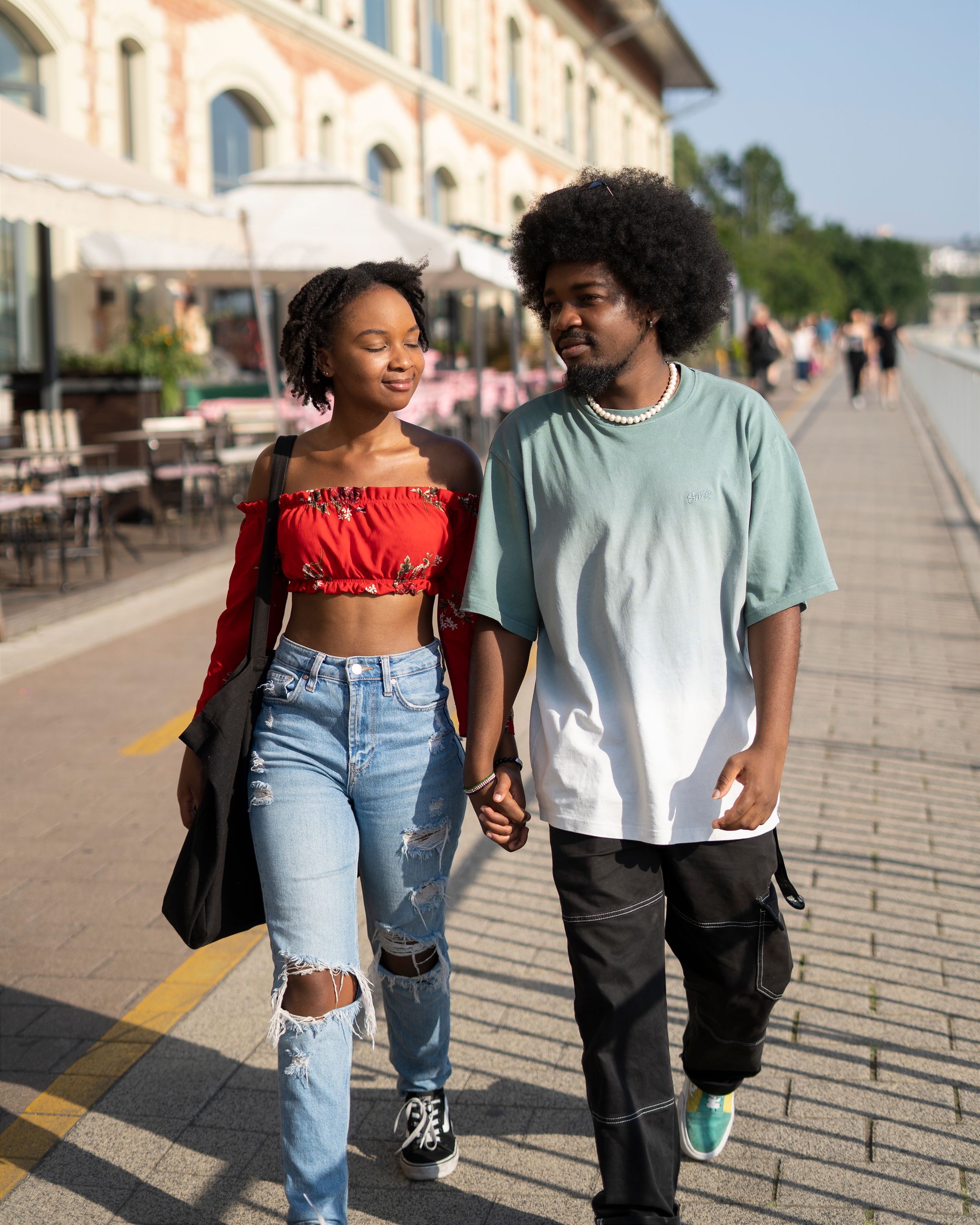 Couple Walking Along the Promenade · Free Stock Photo