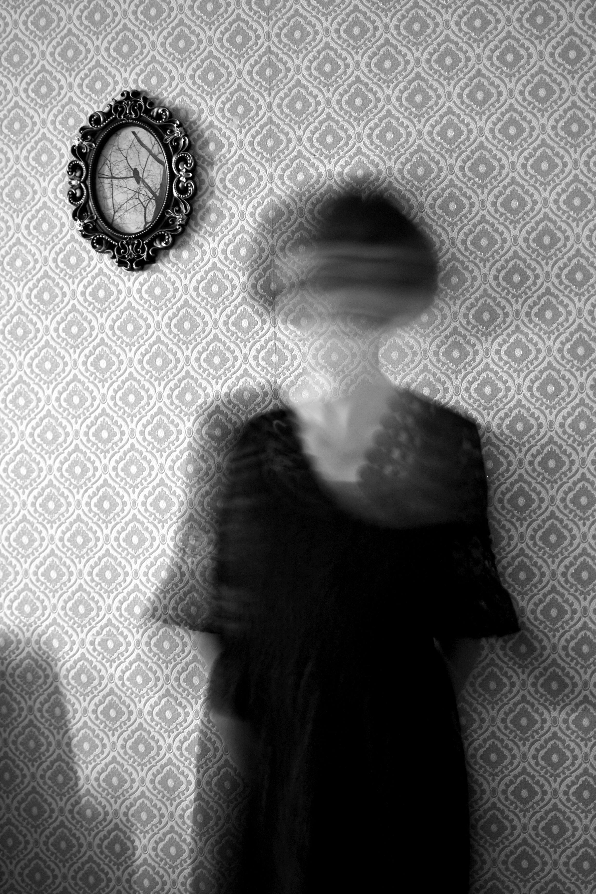Blurred Woman on the Background of a Wall Covered with Wallpaper · Free ...