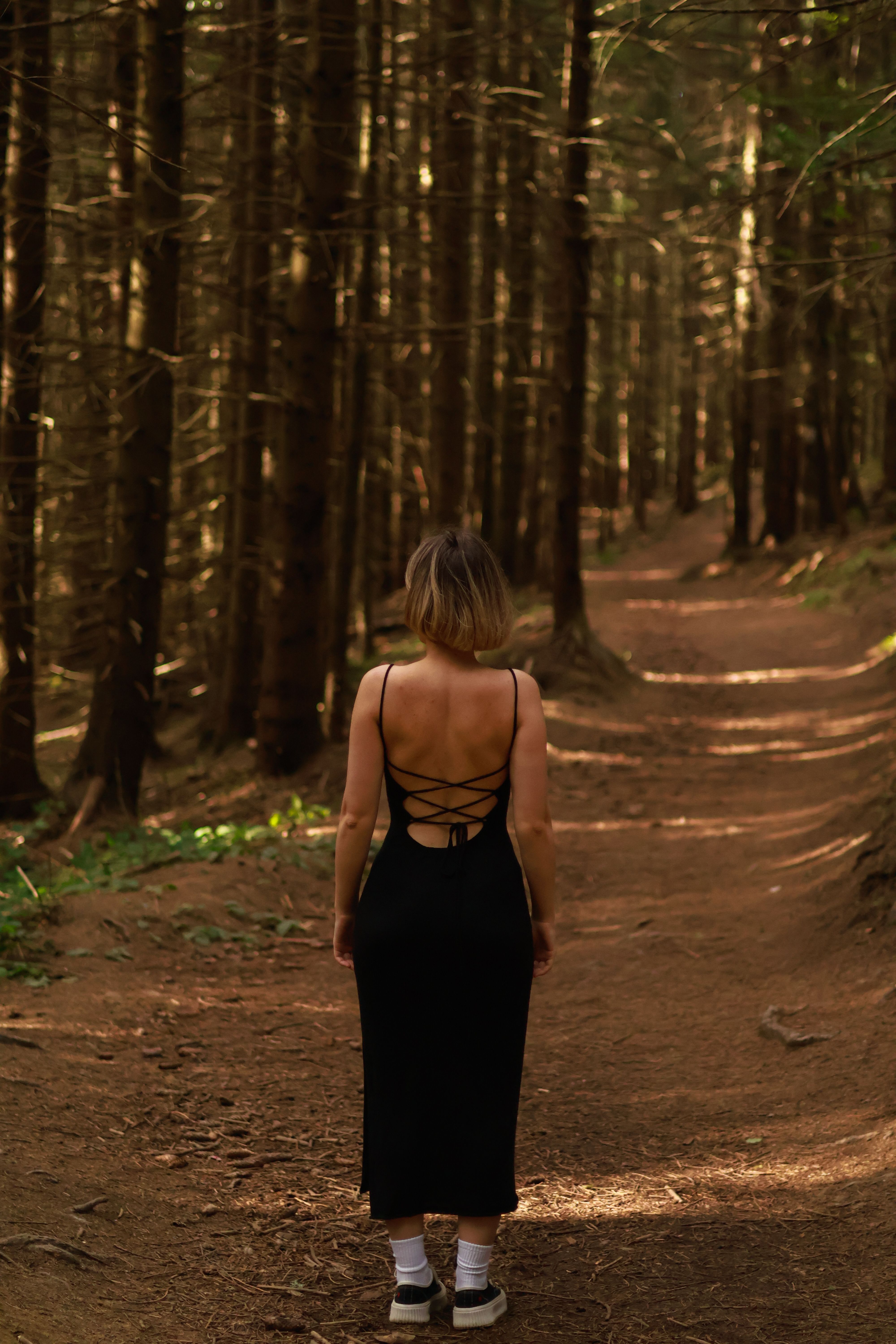 Woman in Black Tied on Back Dress Standing on Path in Forest · Free ...