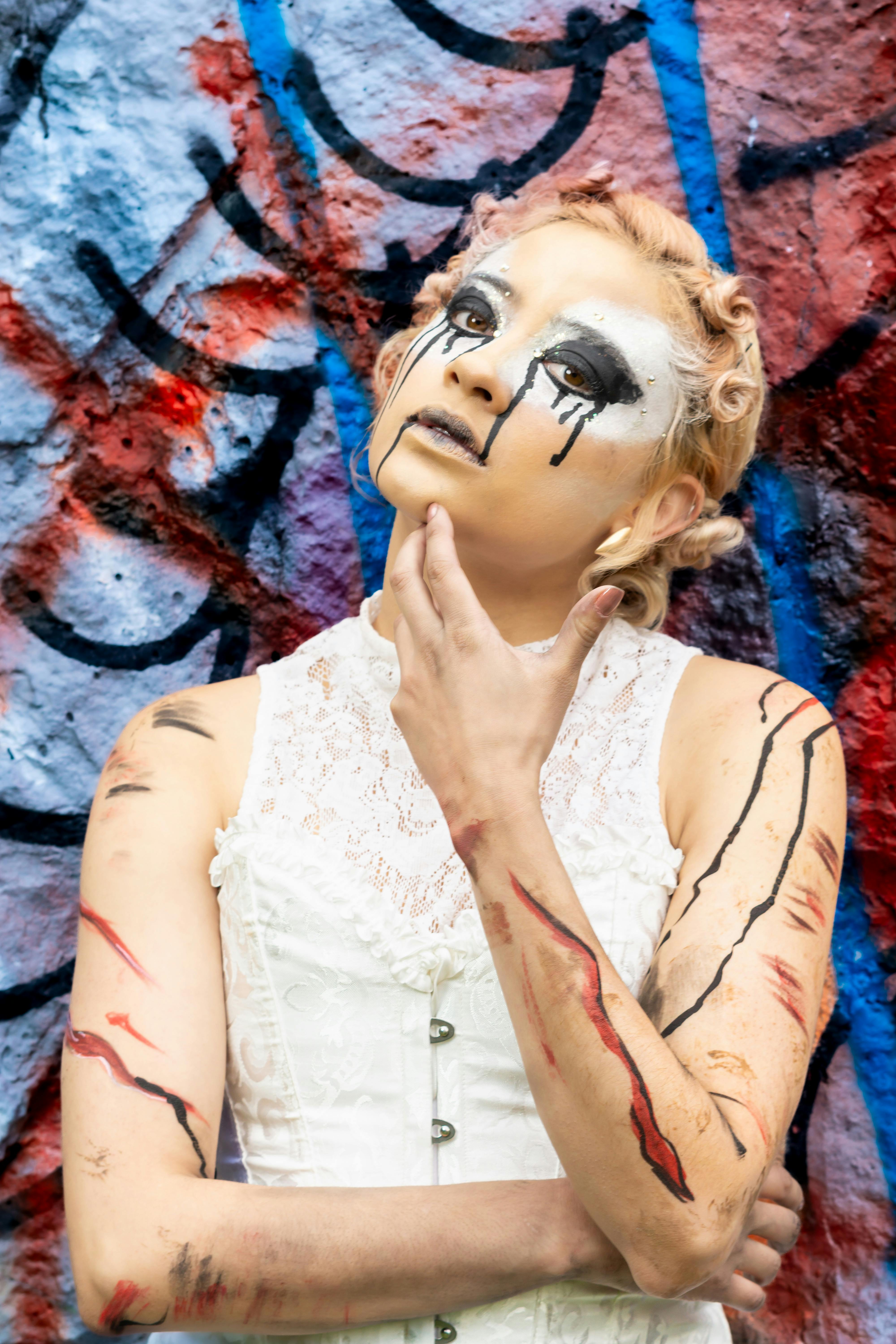 Woman with Face and Body Paint Posing a White Corset · Free Stock Photo