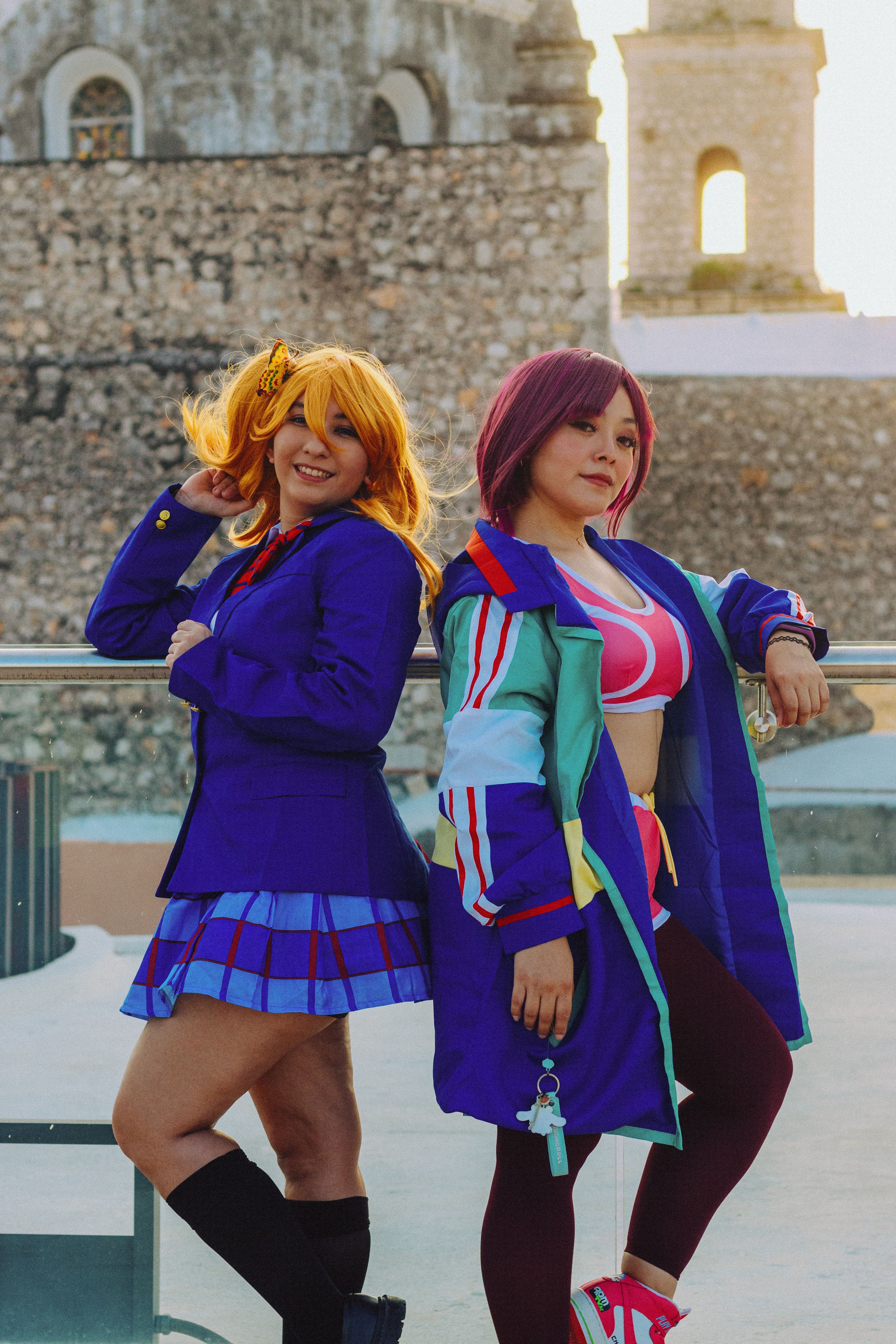 Women in Cosplay Leaning on the Railing · Free Stock Photo