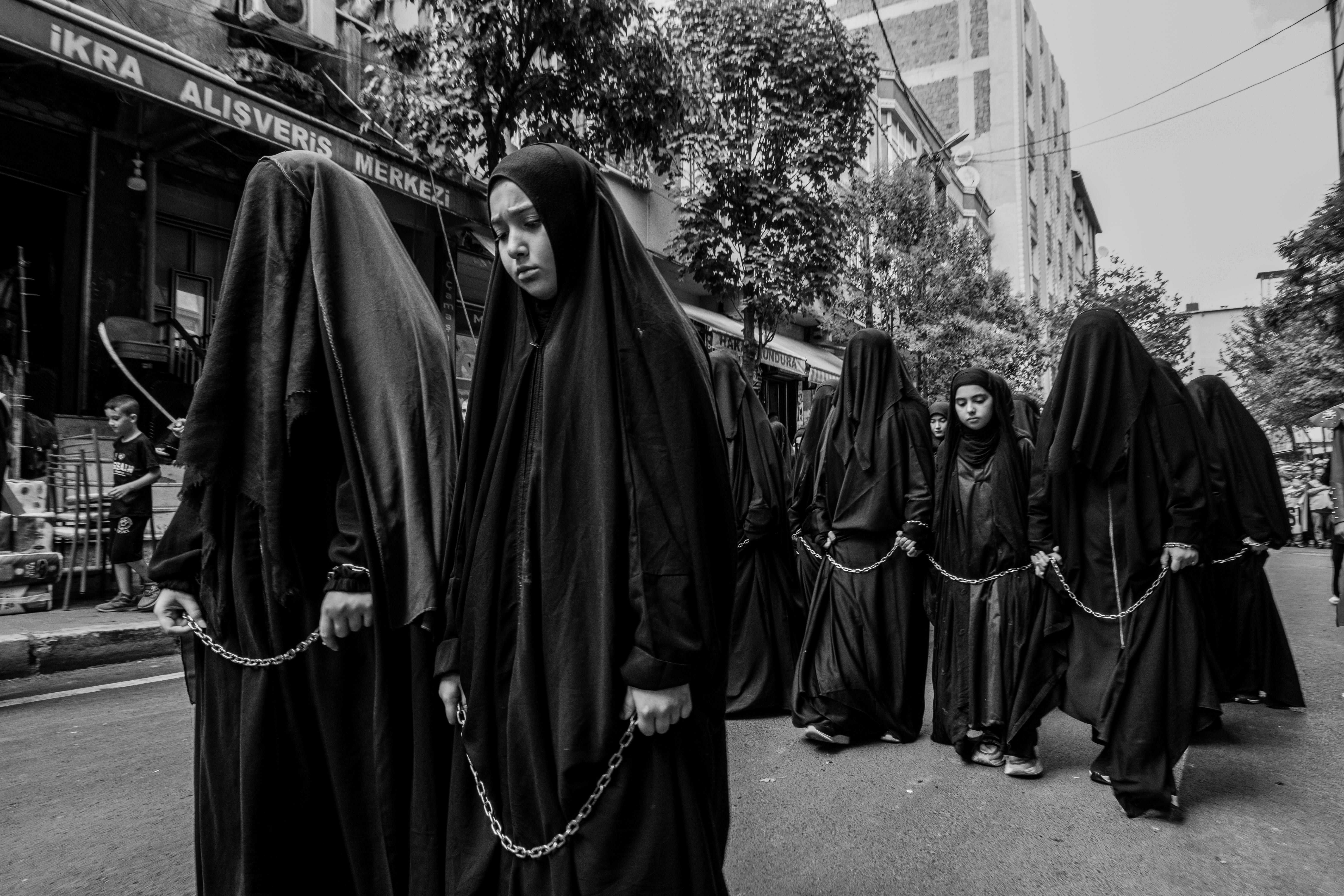 Women Wearing Chains Walking on the Street during the Ashura Mourning ...
