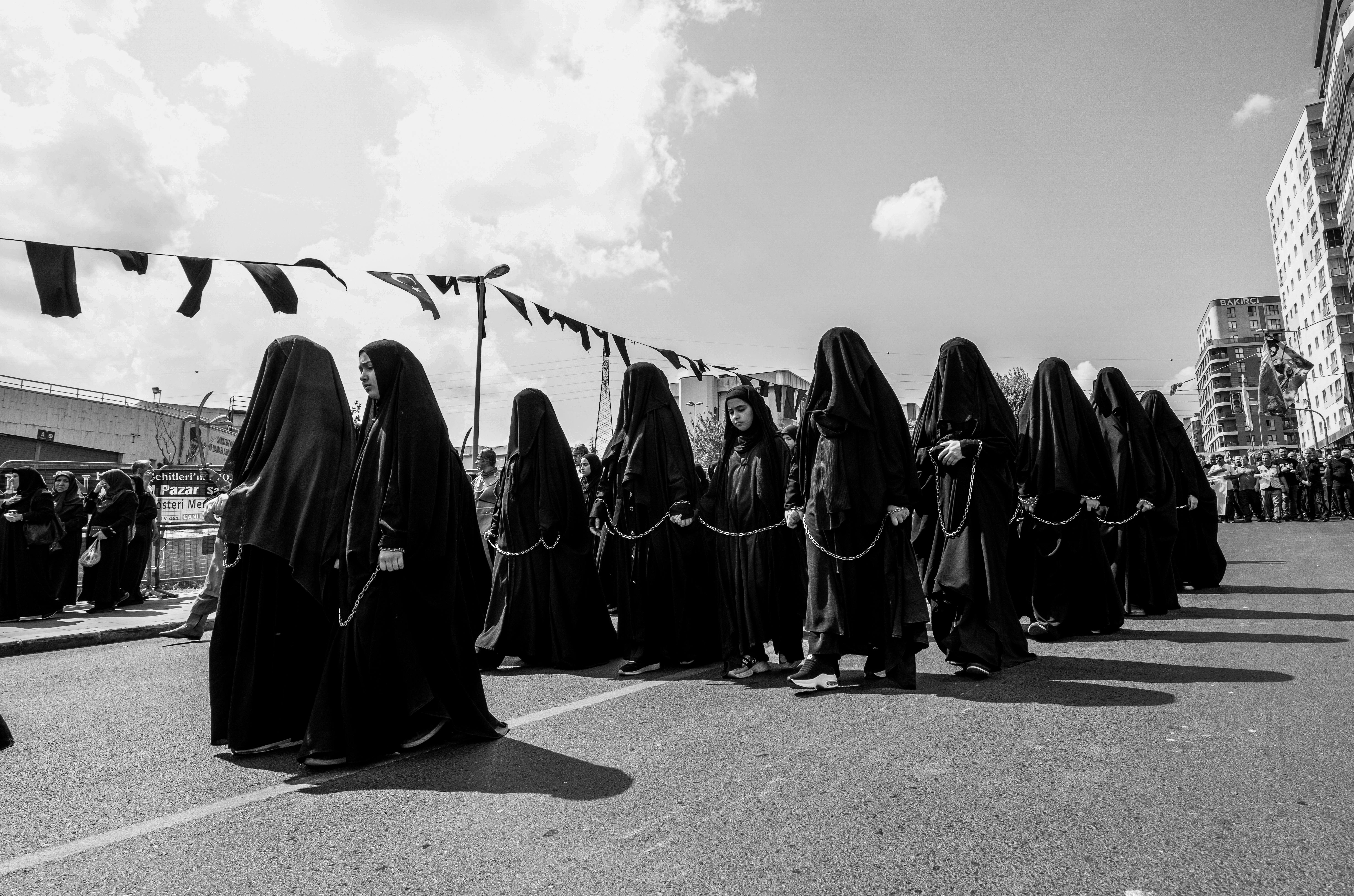 Women Wearing Chains Walking on the Street during the Ashura Mourning ...