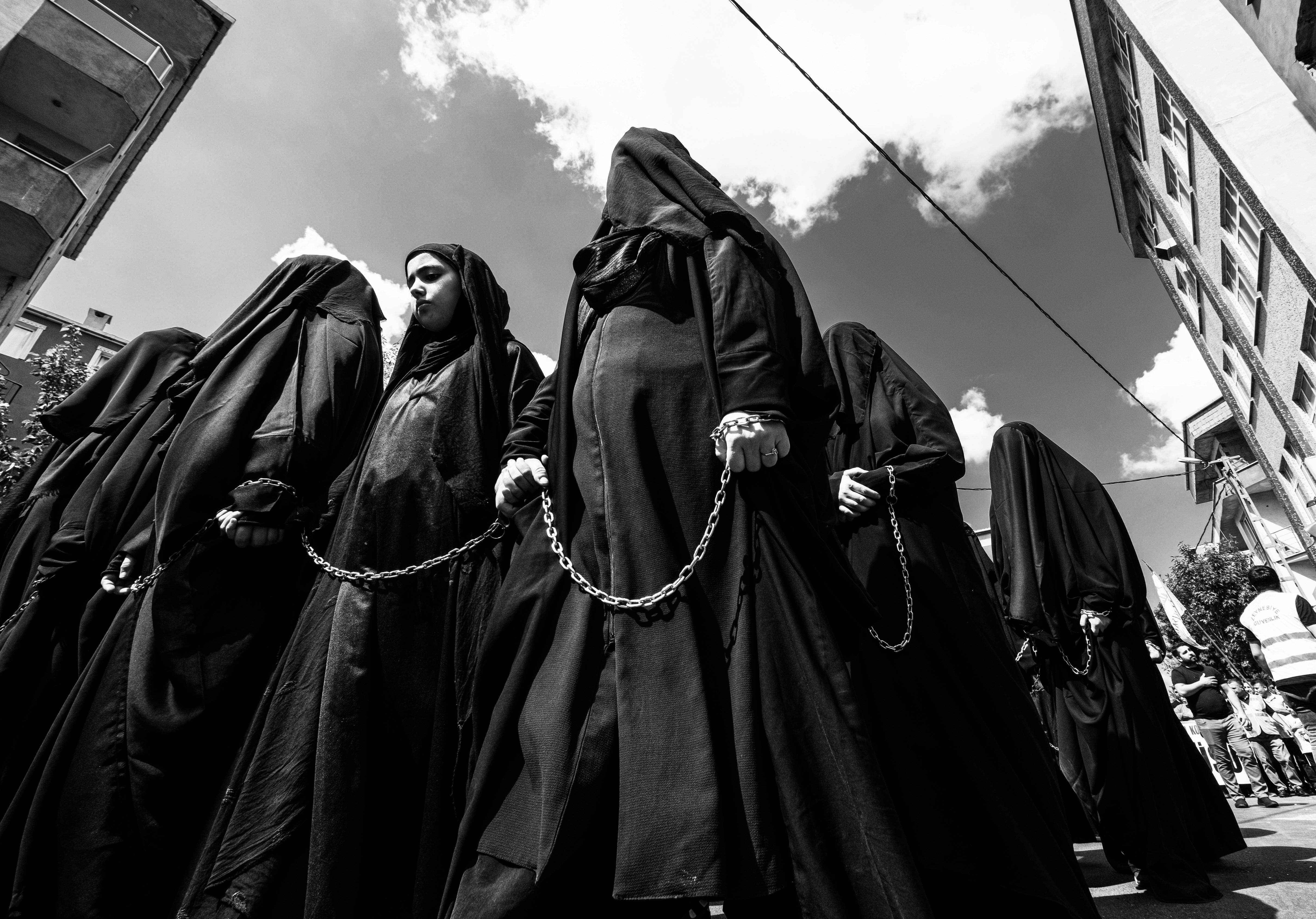 Women Wearing Chains Walking on the Street during the Ashura Mourning ...