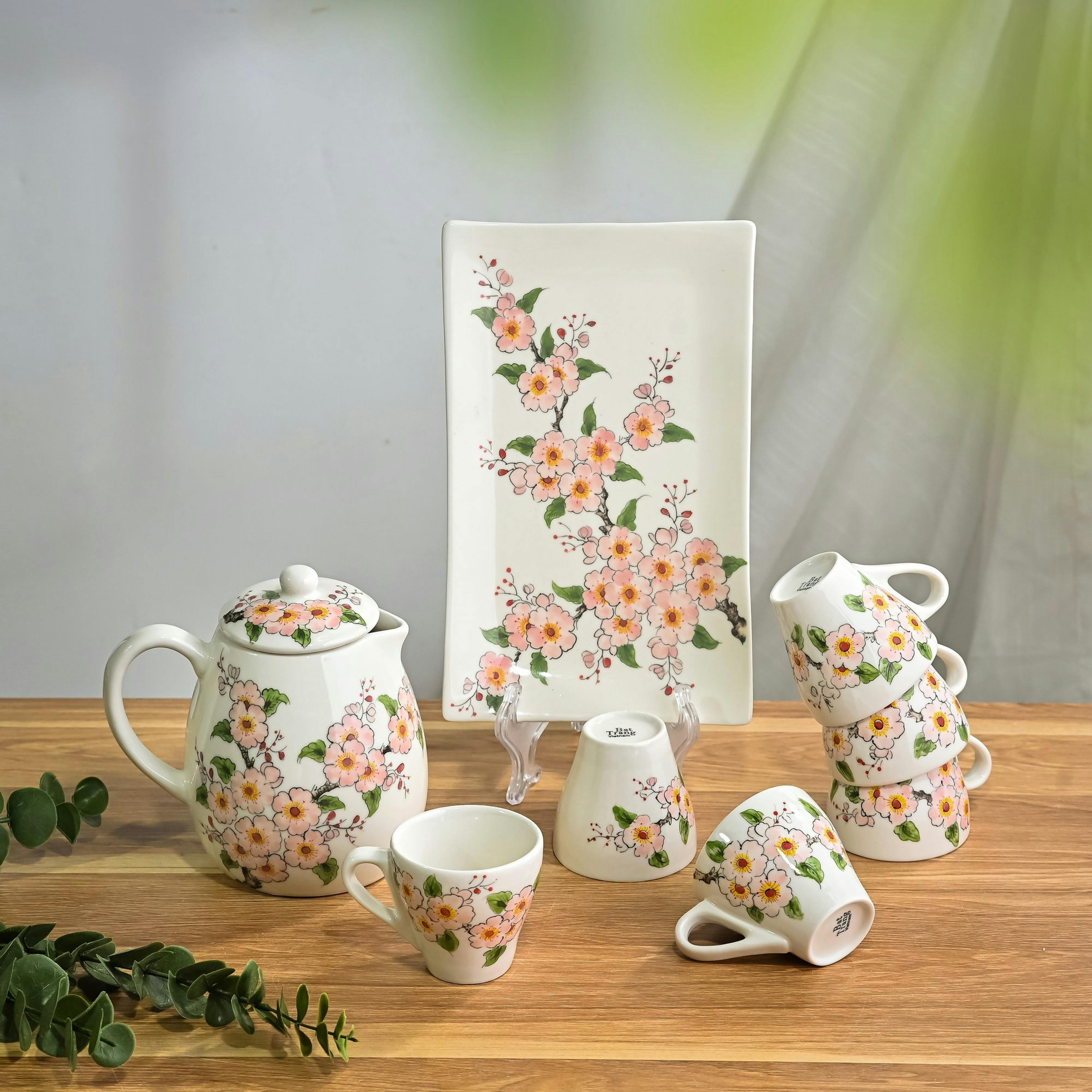 Floral Pottery Set on Wooden Table · Free Stock Photo