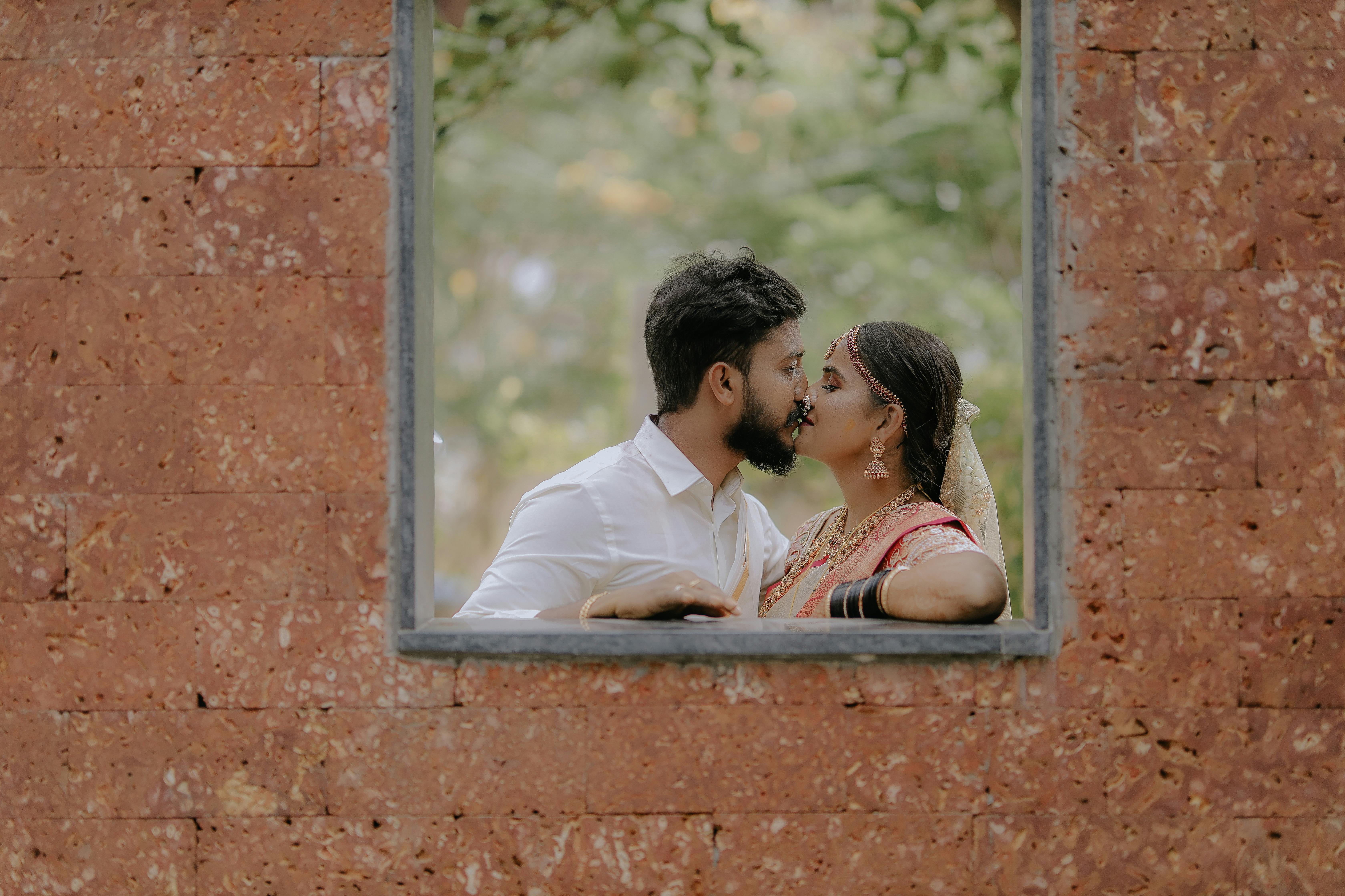 Couple Kissing in Window · Free Stock Photo