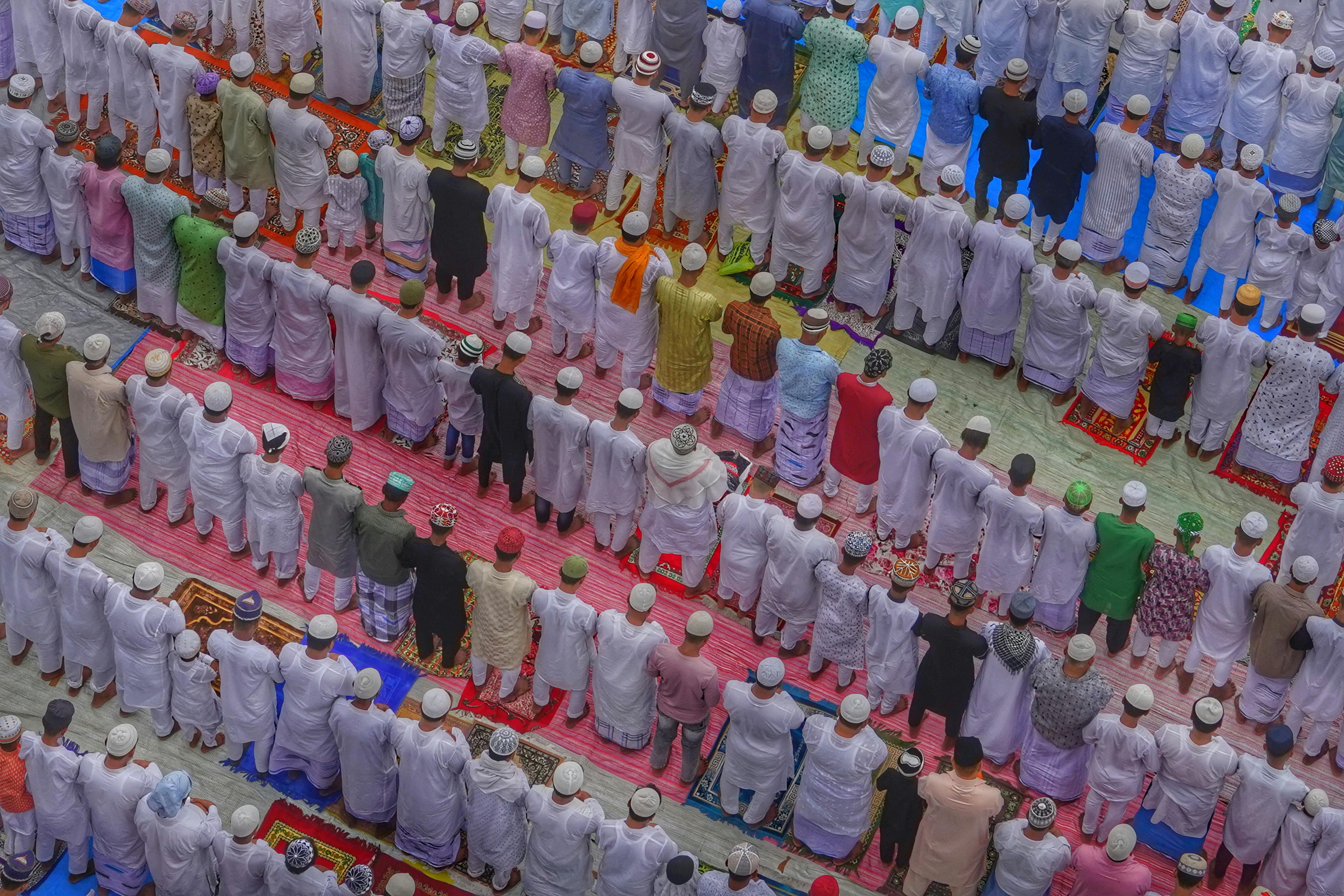 High Angle View of Muslim Men Praying · Free Stock Photo