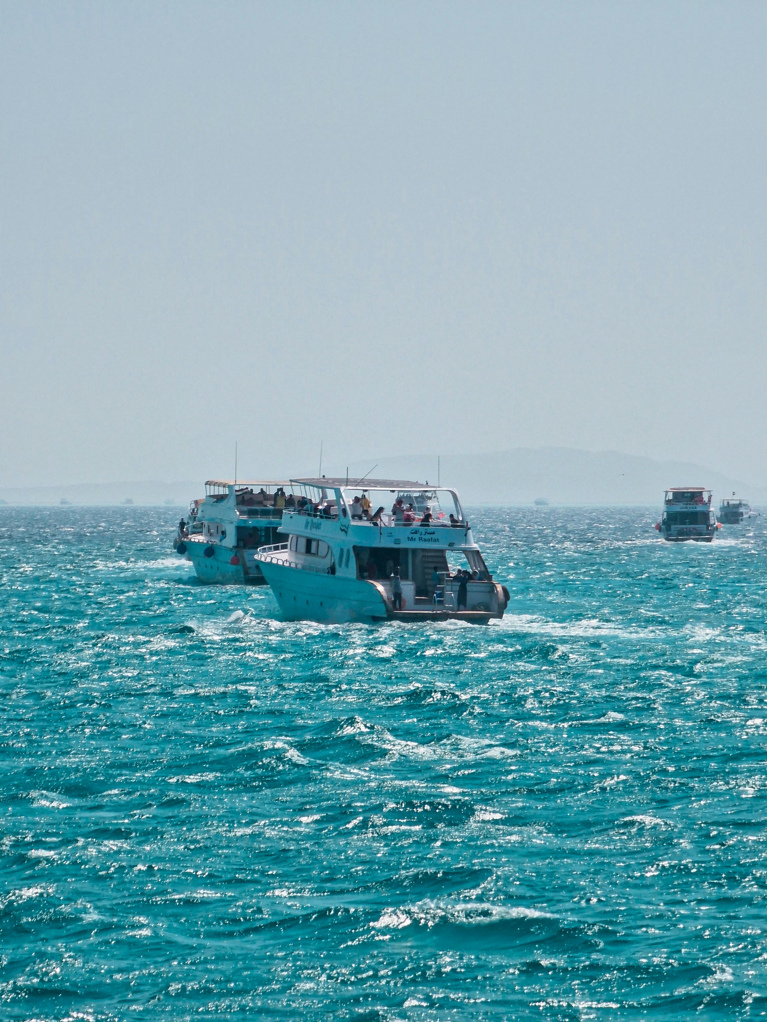 Tour Boats Sailing in Shiny Turquoise Sea Water · Free Stock Photo