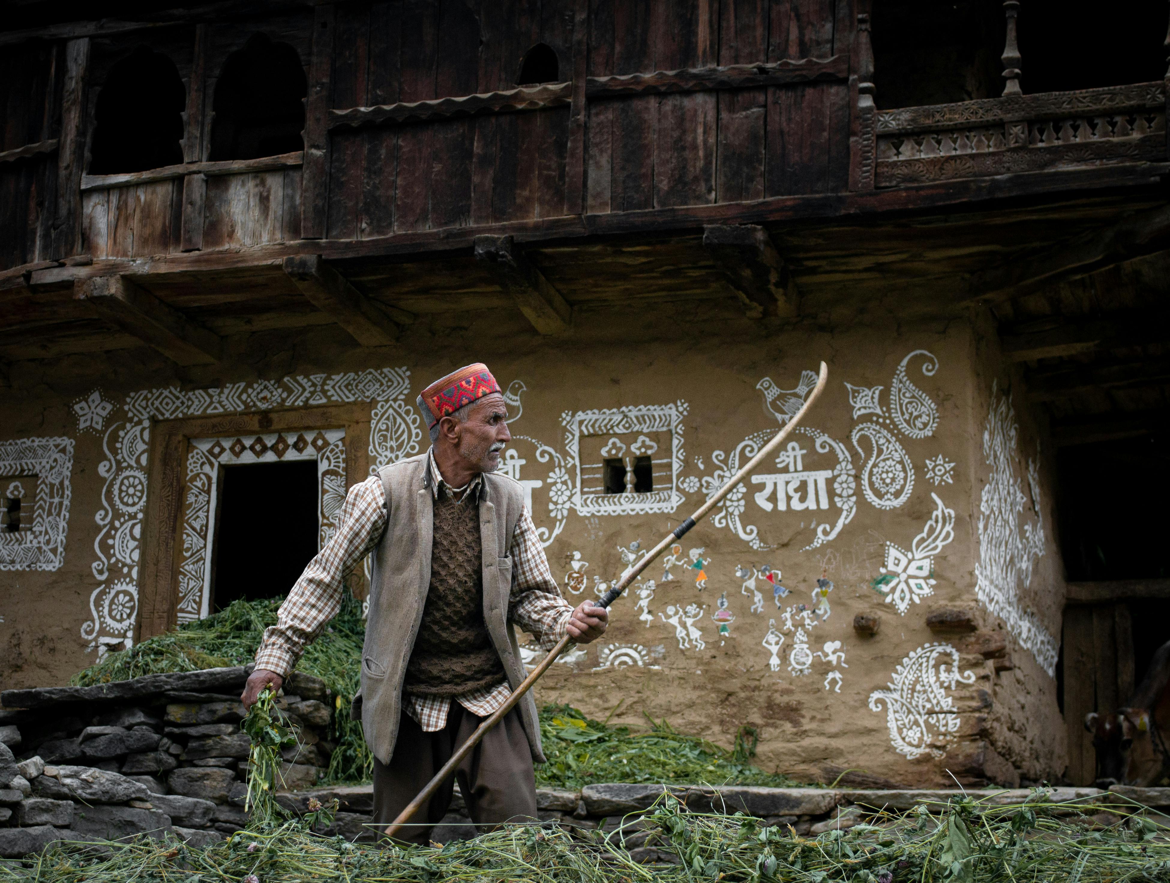 Man in Traditional Clothing in Village · Free Stock Photo