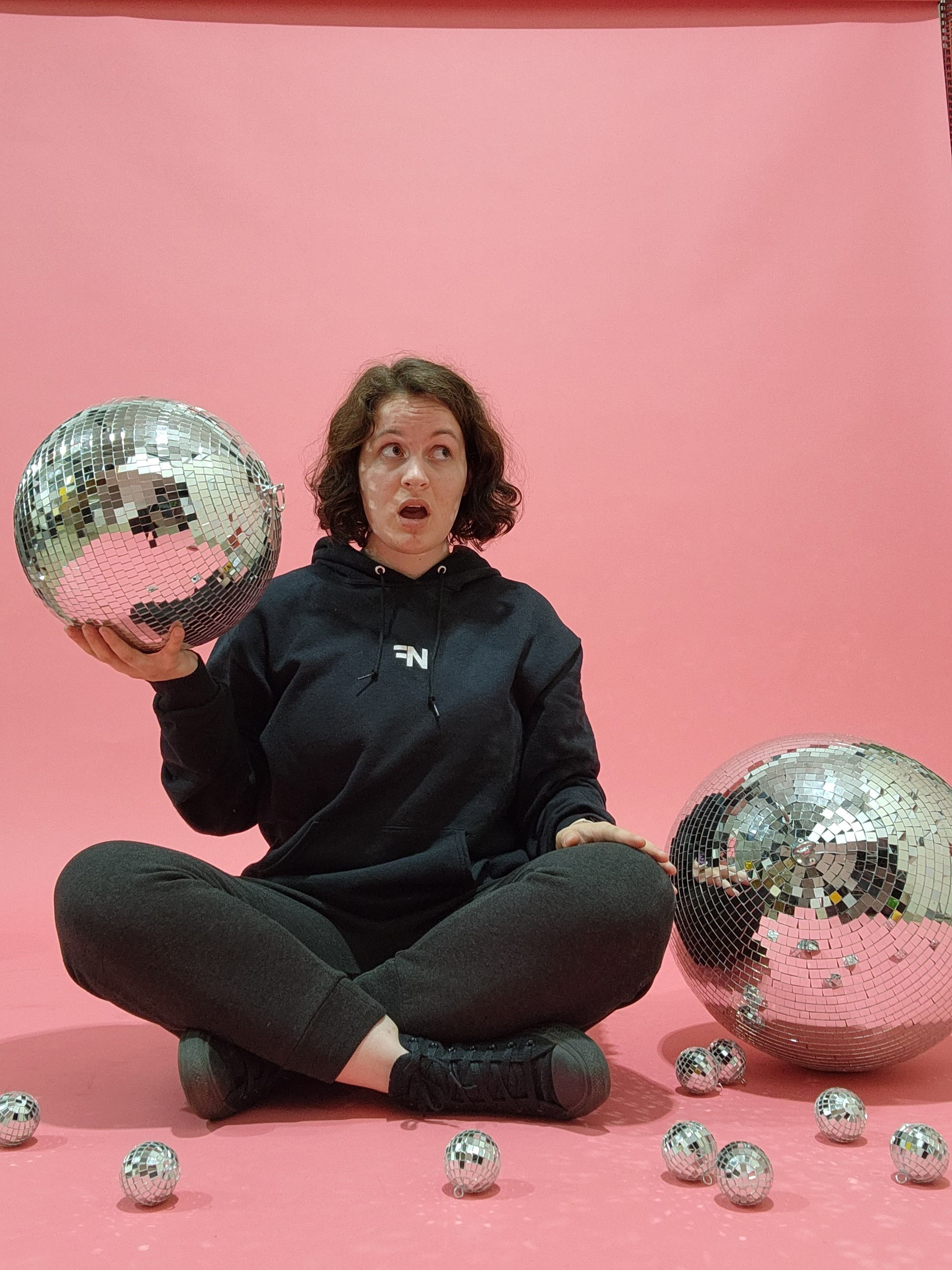 Plus Size Woman with Disco Balls on Pink Studio Background · Free Stock ...