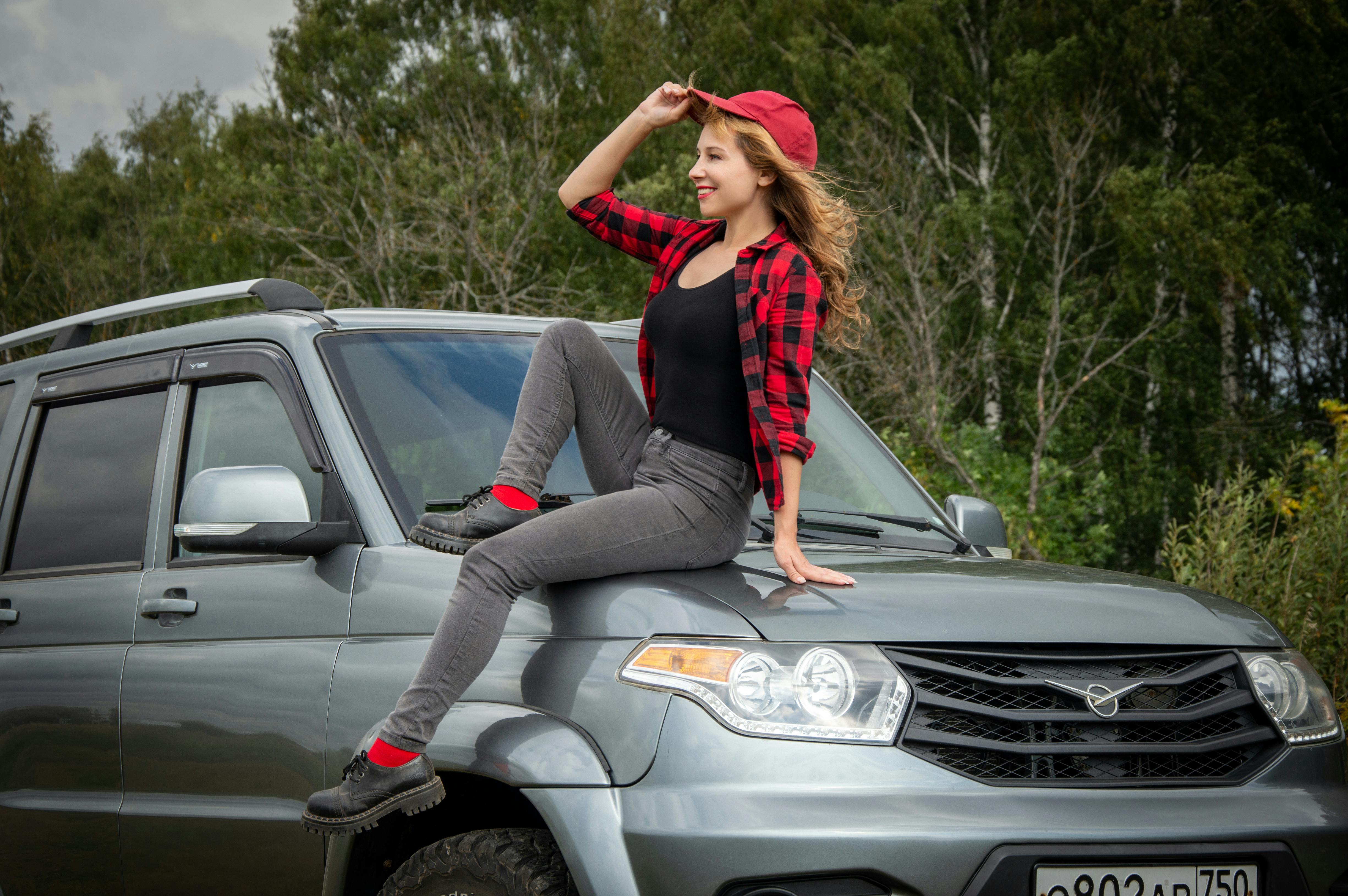 Black SUV between Bridge Columns · Free Stock Photo