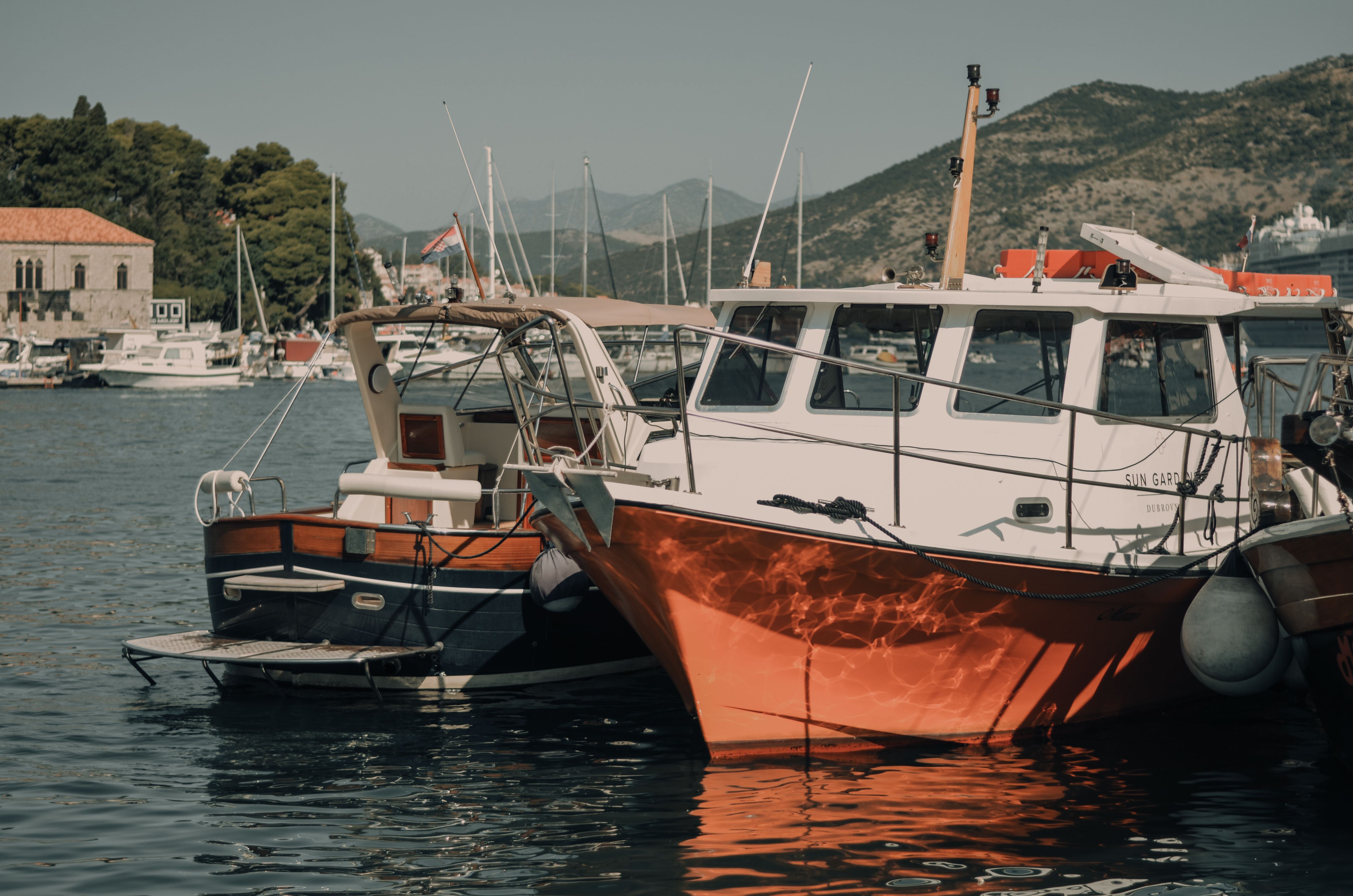 Yacht Tied Board to Board in Harbor · Free Stock Photo