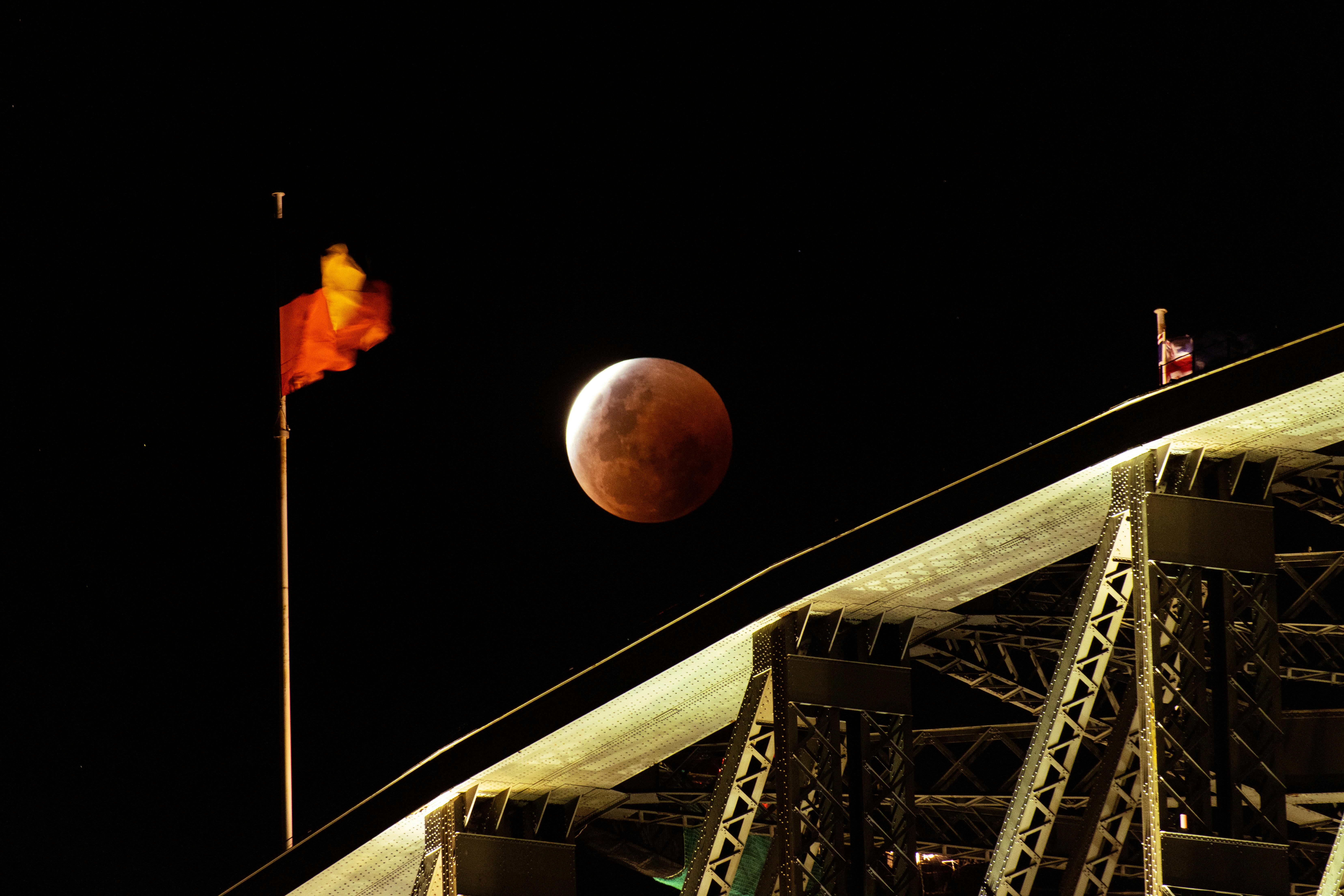 Red Moon Over the Bridge During a Lunar Eclipse · Free Stock Photo