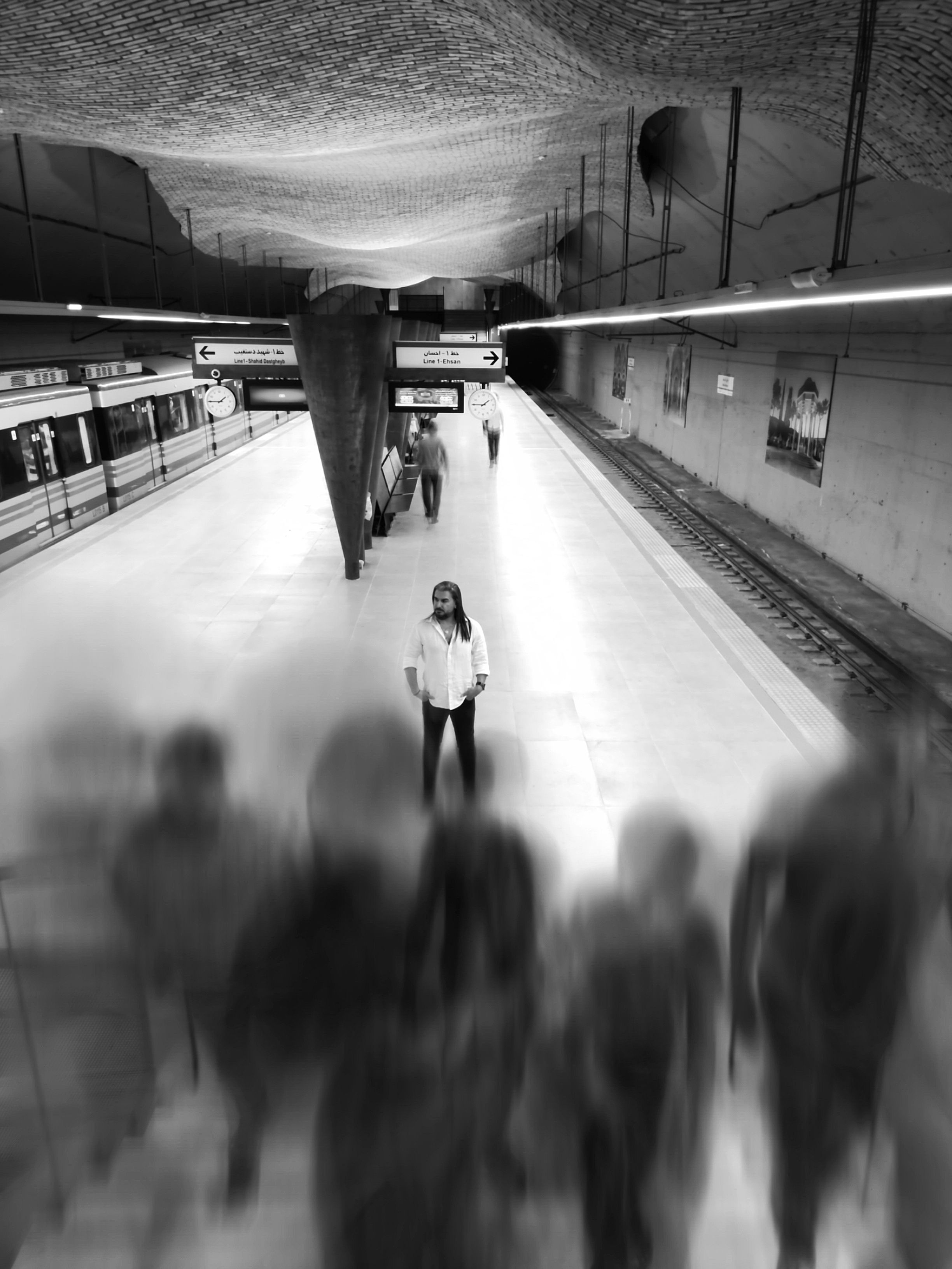 Man behind People Walking on Train Station Platform · Free Stock Photo