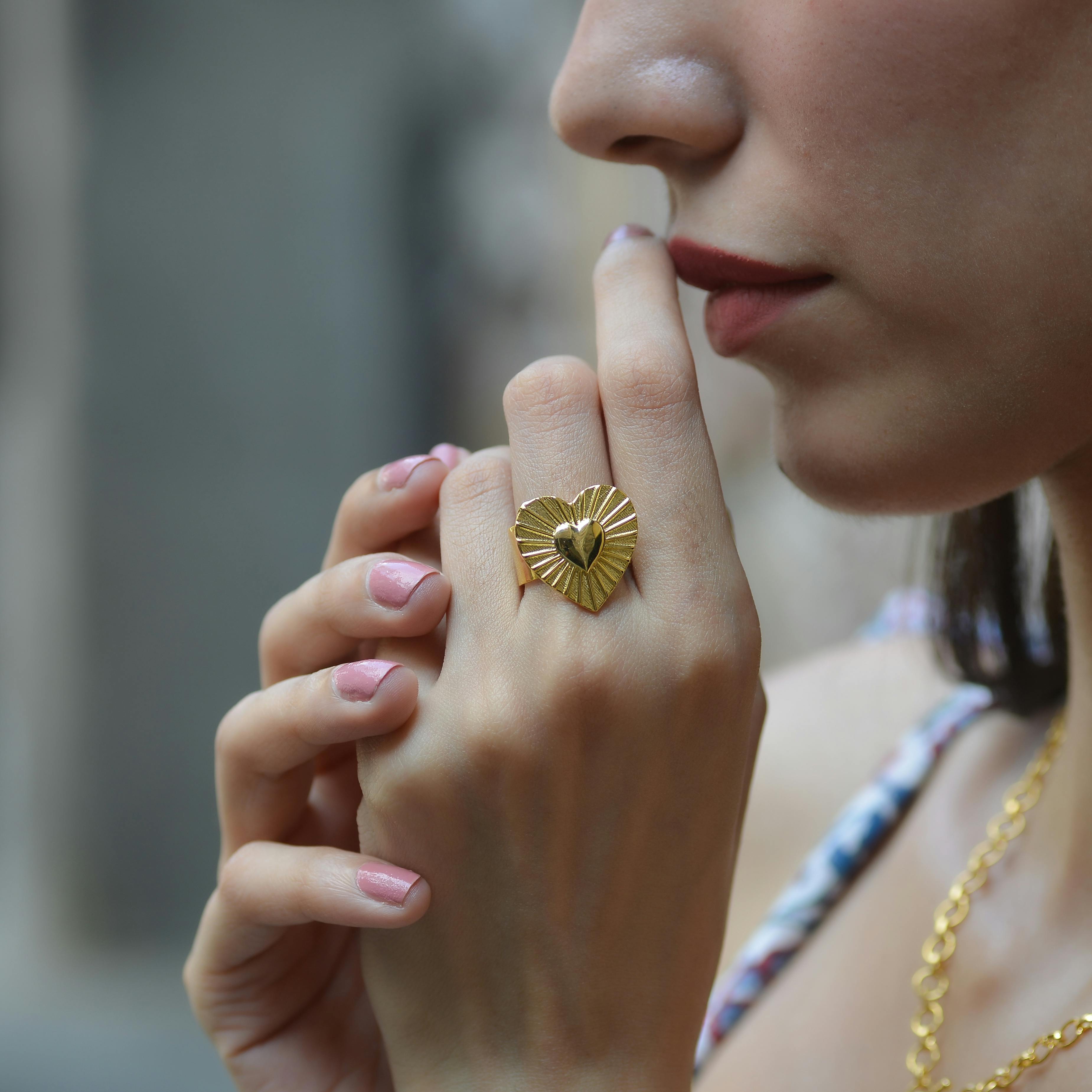 Person Wearing Gold-colored Rings Holding Head · Free Stock Photo