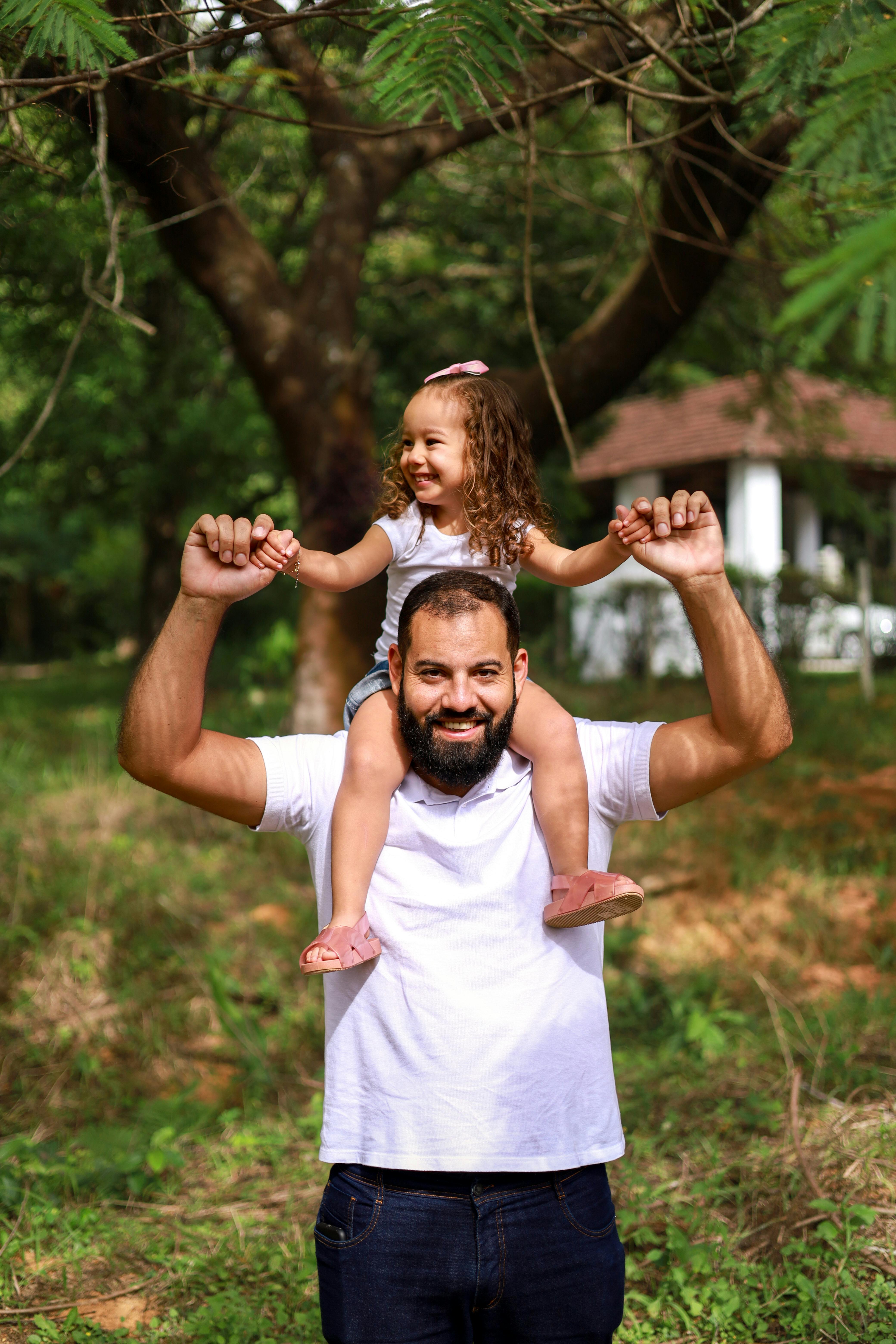 Father Standing with Daughter on Beach · Free Stock Photo