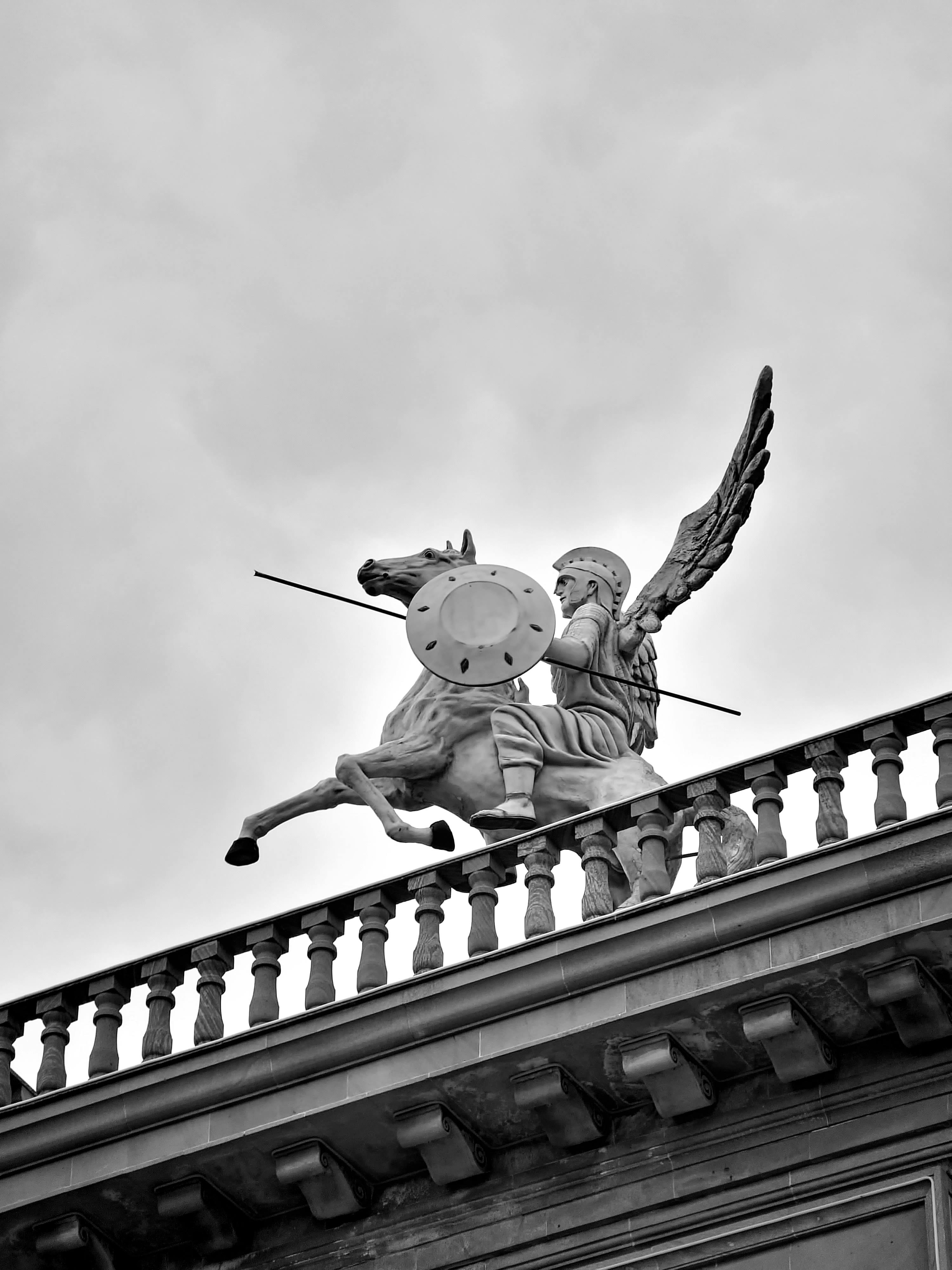 Statue of Man with Wing in Ancient Armour · Free Stock Photo