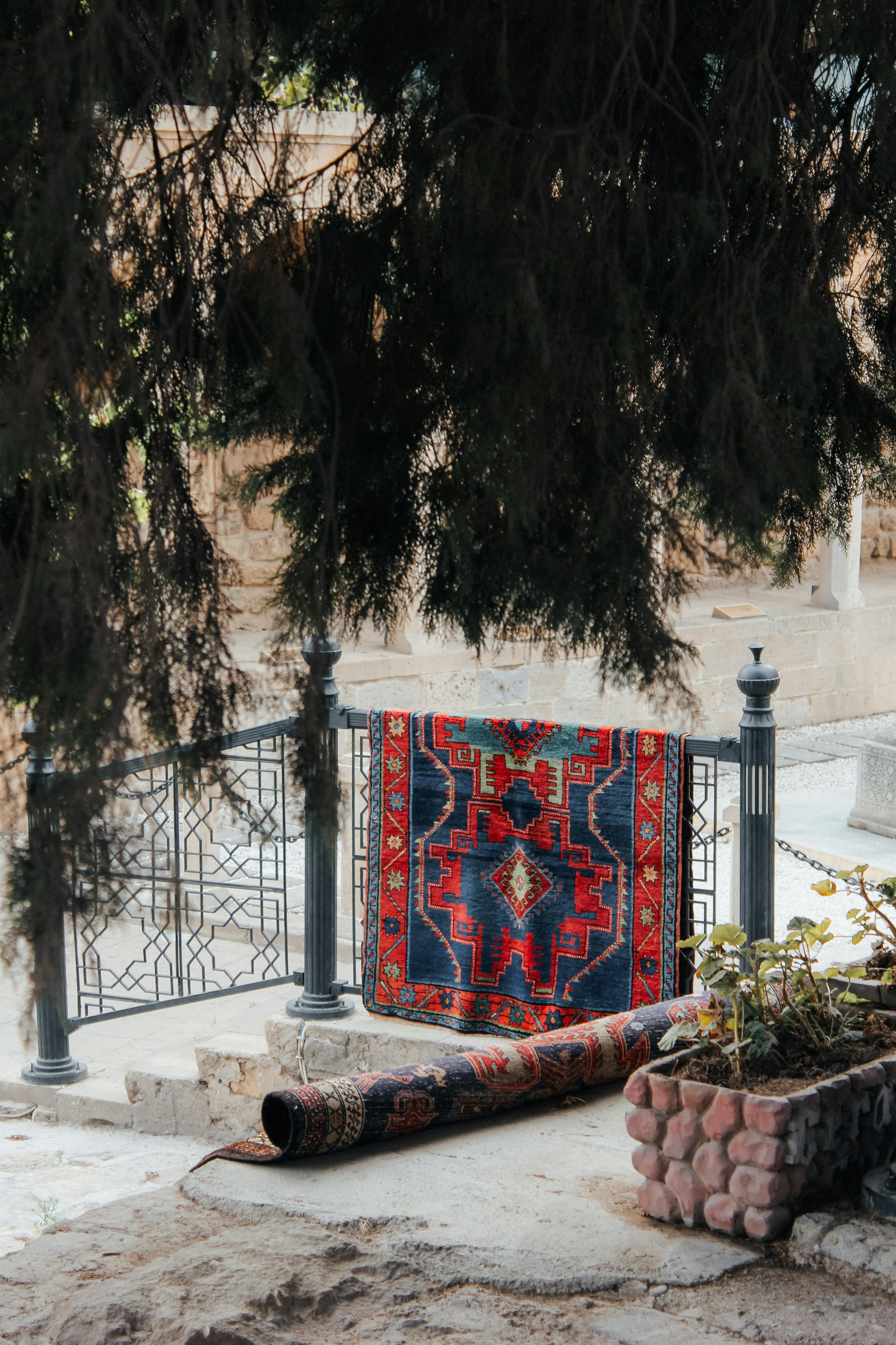 Traditional Turkish Rugs Displayed on the Street · Free Stock Photo