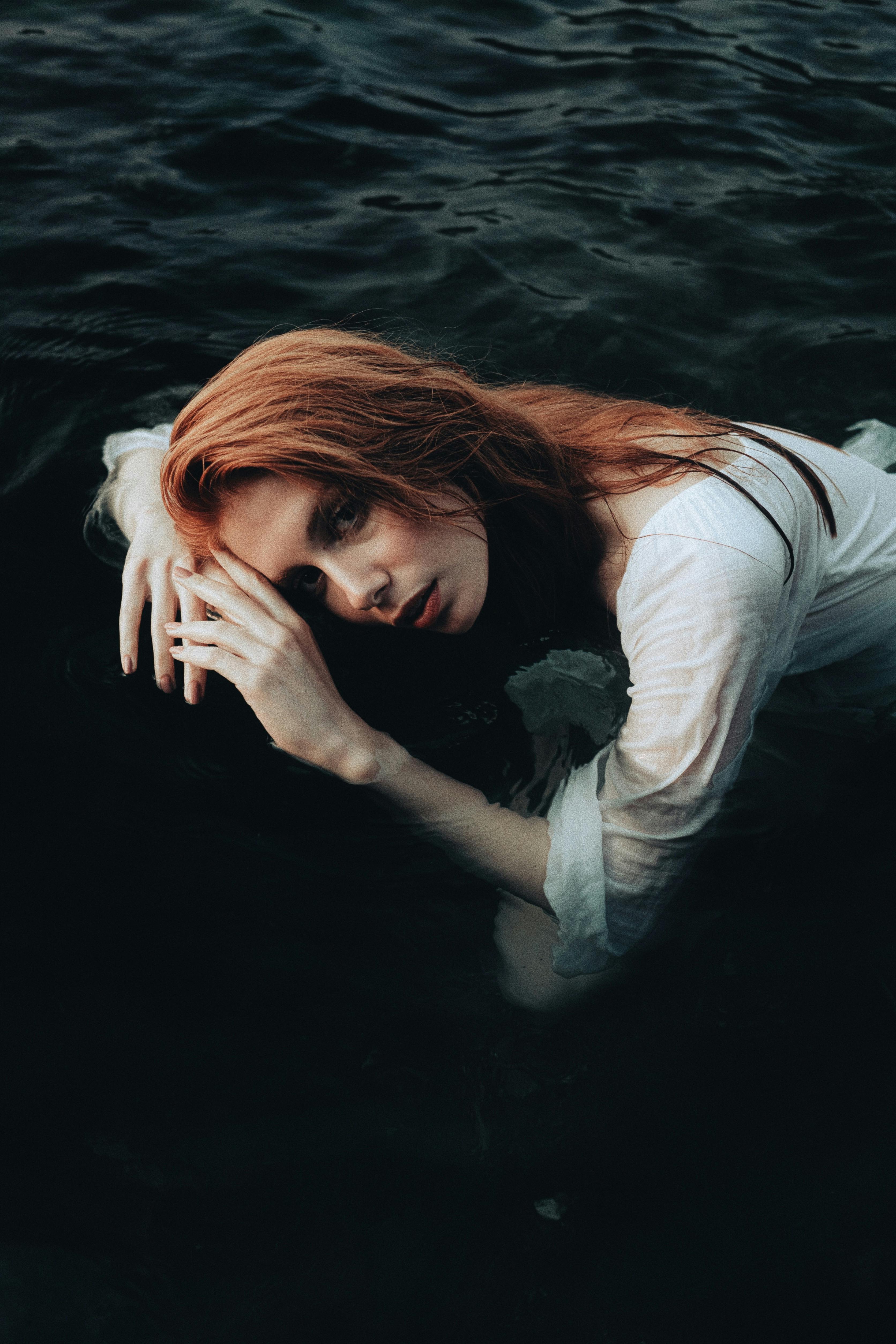 Beautiful Woman Lying in the Sea · Free Stock Photo