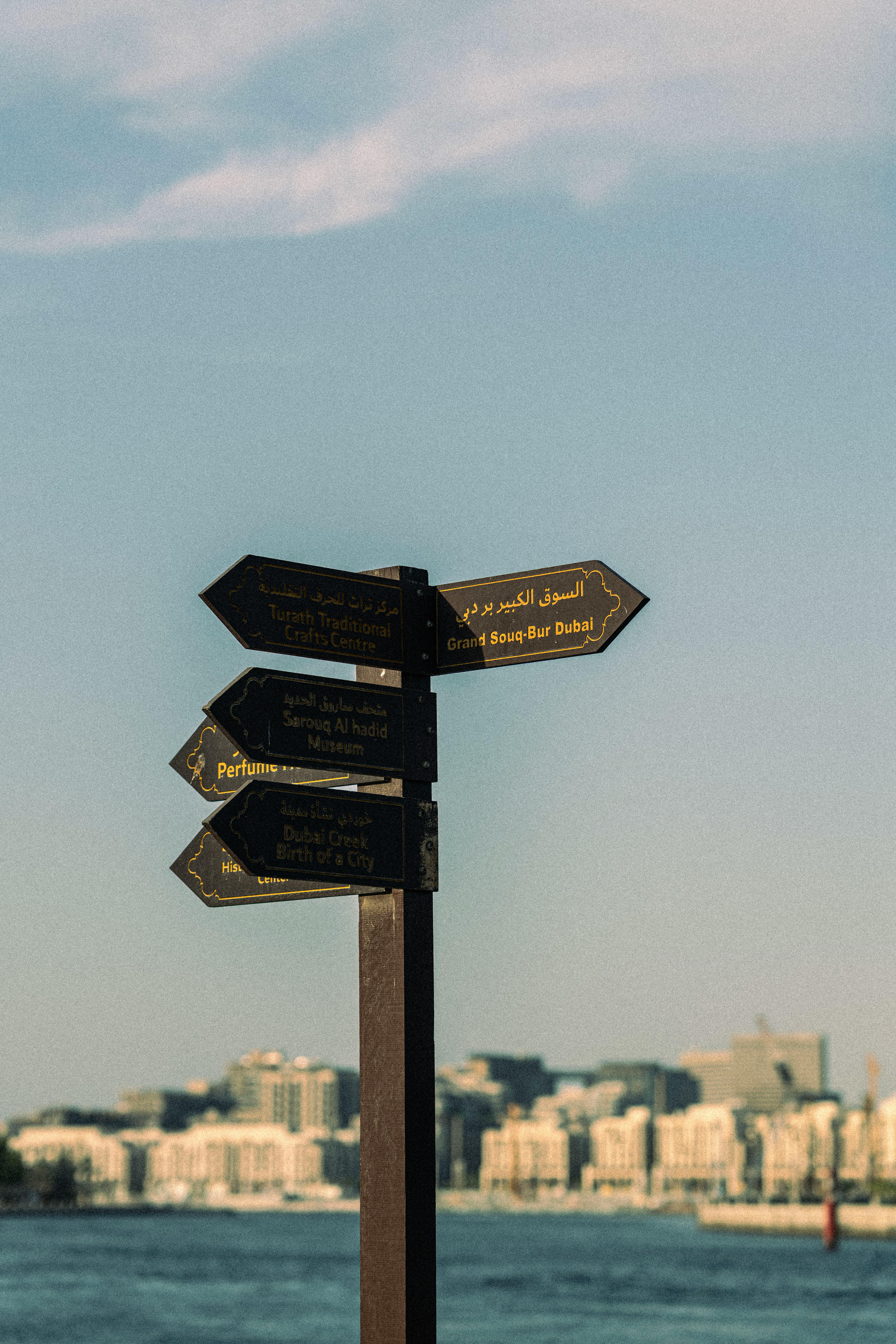 Colorful Wooden Signage Pointing Directions · Free Stock Photo